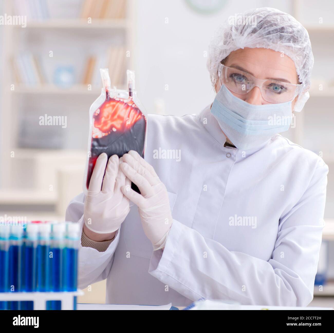The woman doctor checking blood samples in lab Stock Photo - Alamy