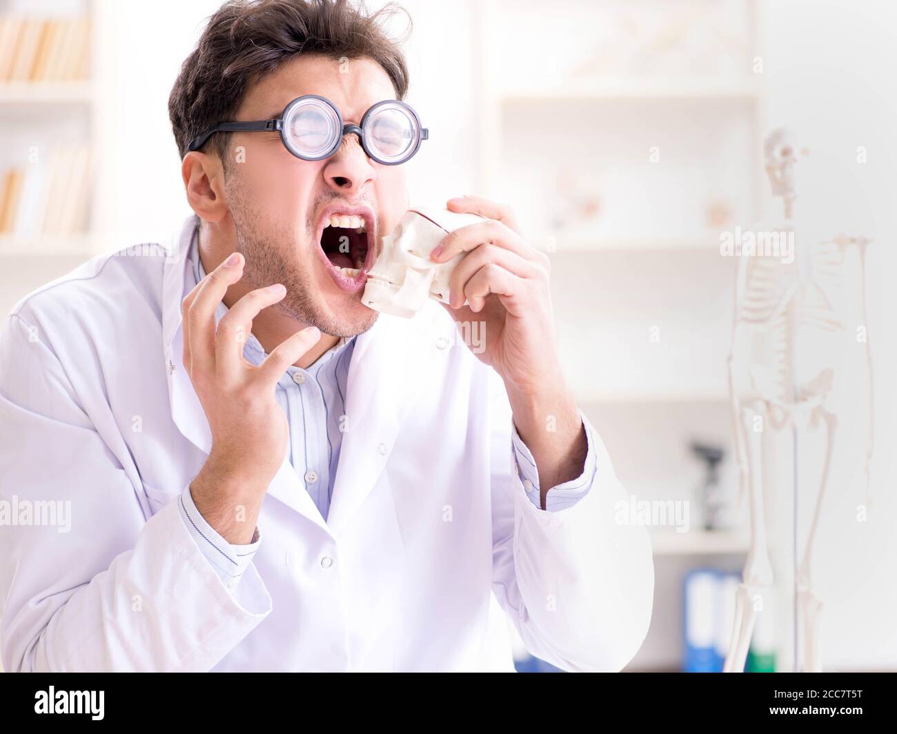 The crazy doctor studying human skeleton Stock Photo - Alamy