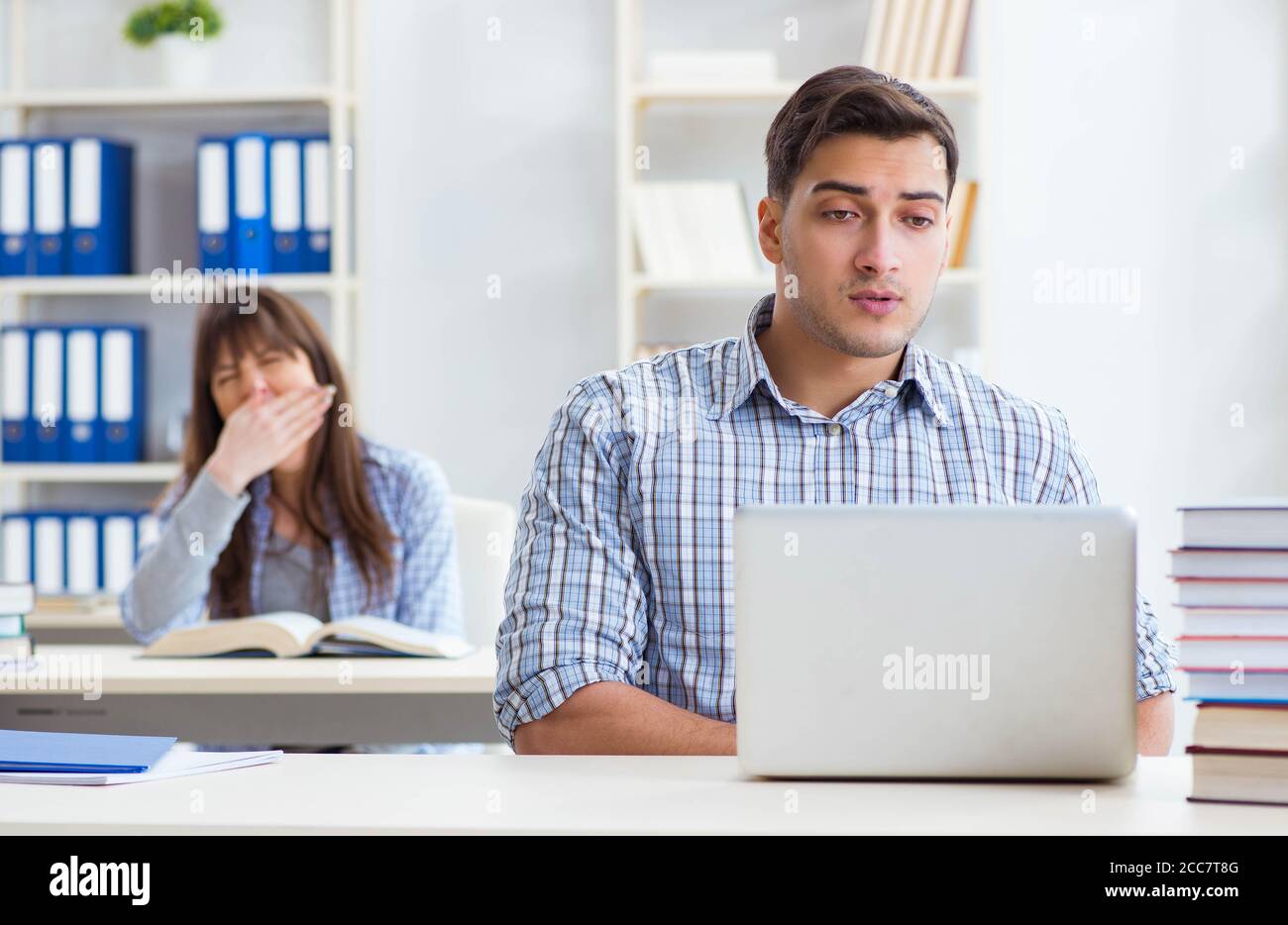 The students sitting and studying in classroom college Stock Photo - Alamy