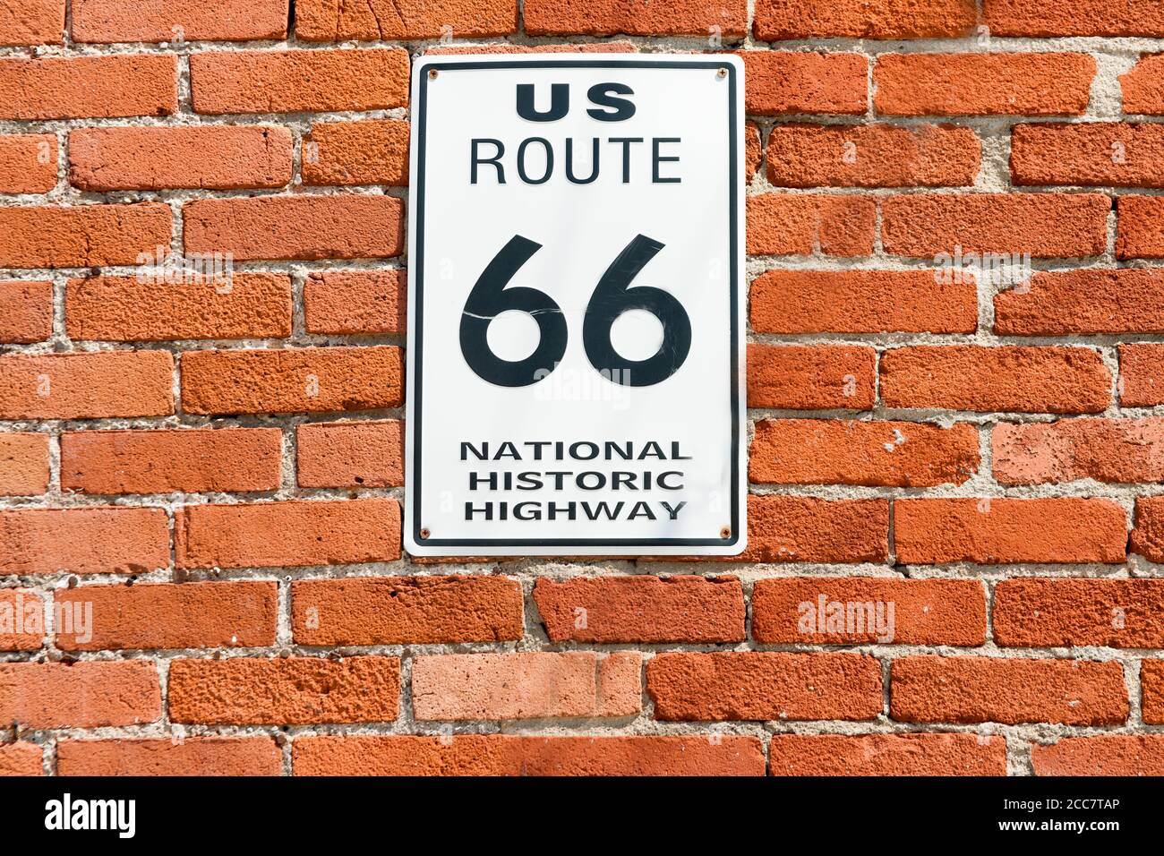 US Route 66 National Historic Highway sign on red brick wall, Galena ...