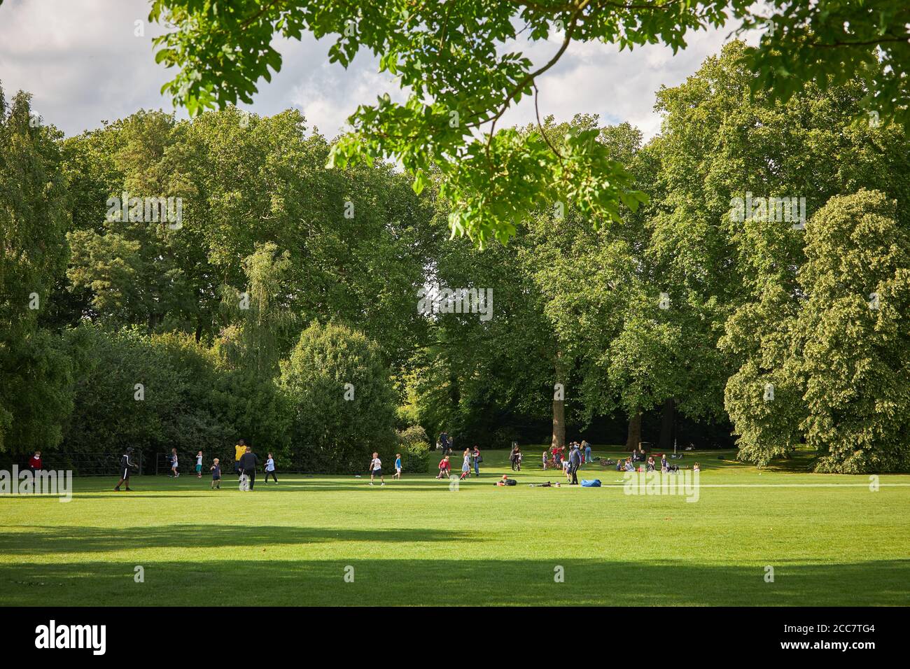 Summer games in a Battersea Park playing field surrounded by trees in ...