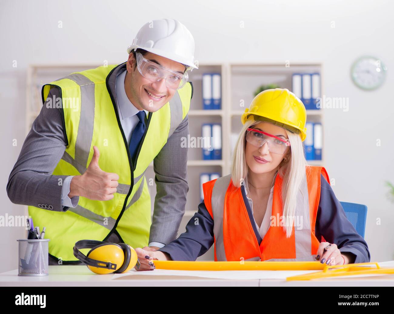 Construction workers having discussion in office before starting ...