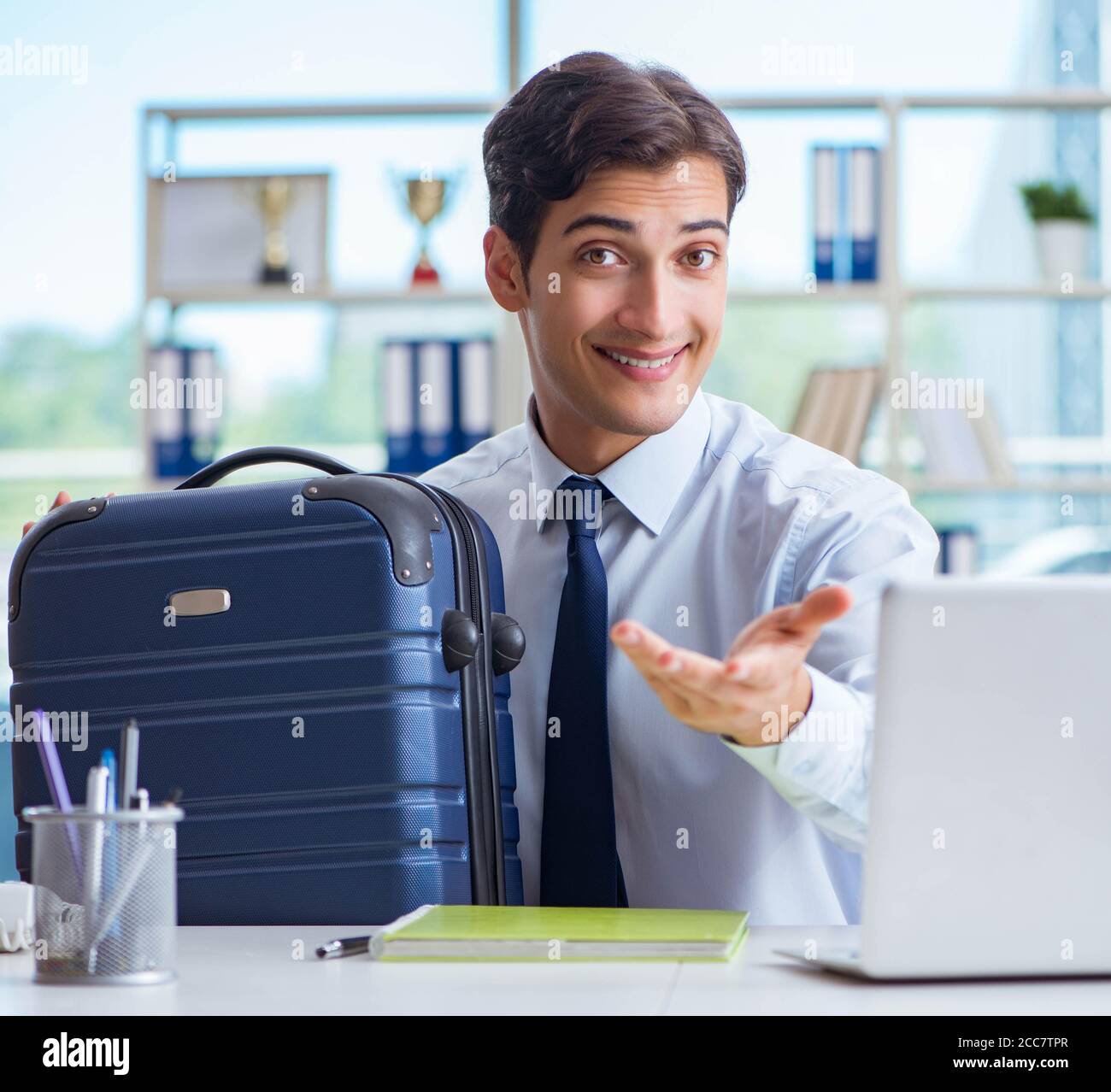 The businessman thinking of vacation travel Stock Photo - Alamy