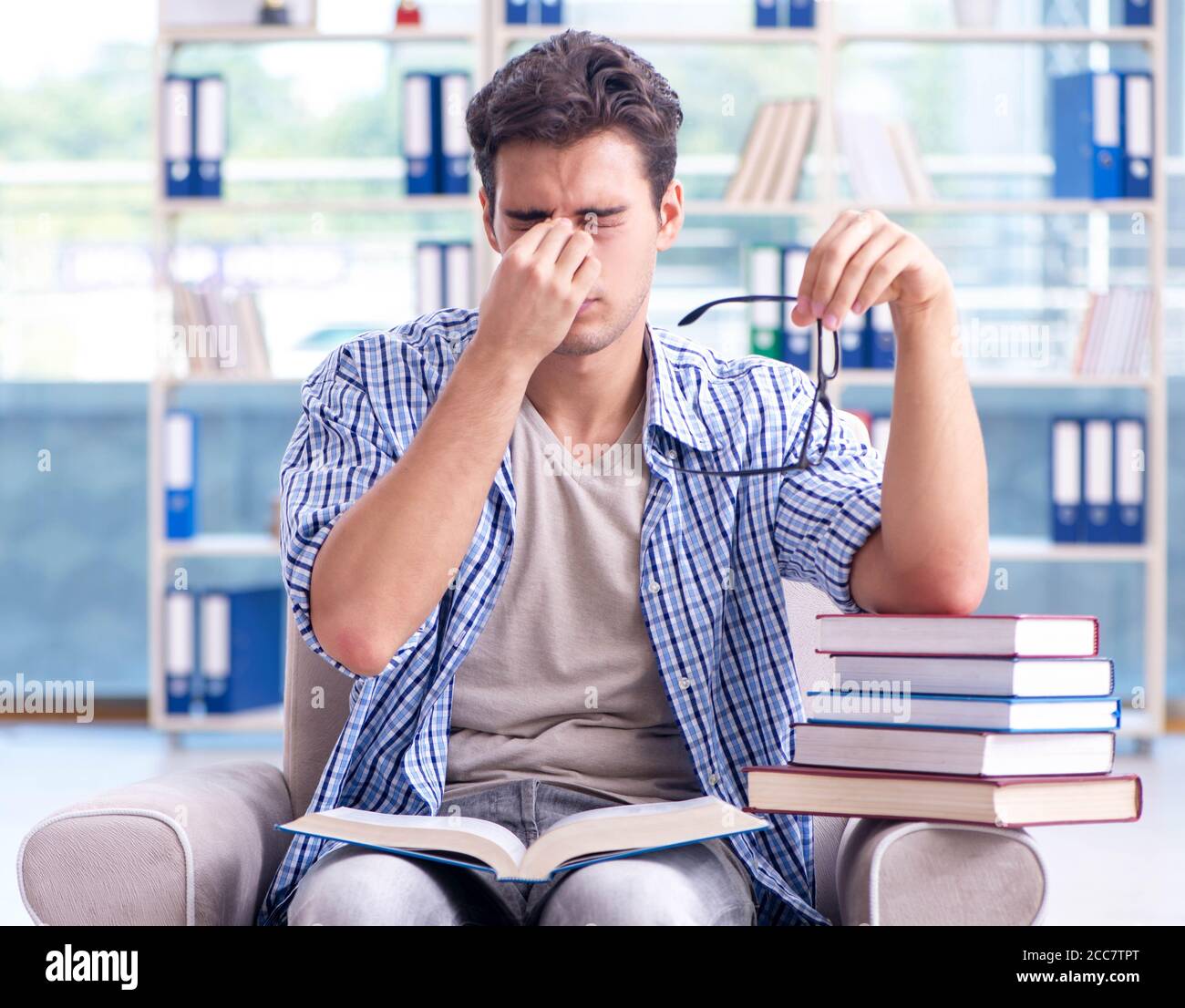 The student reading books and preparing for exams in library Stock ...