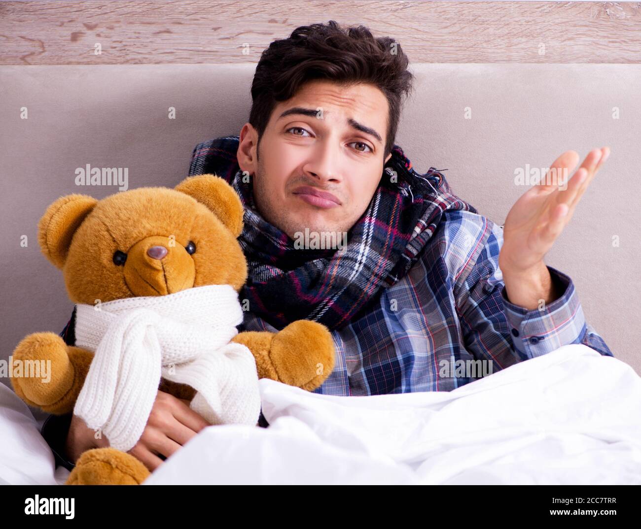 The sick man suffering from flu in the bed Stock Photo - Alamy
