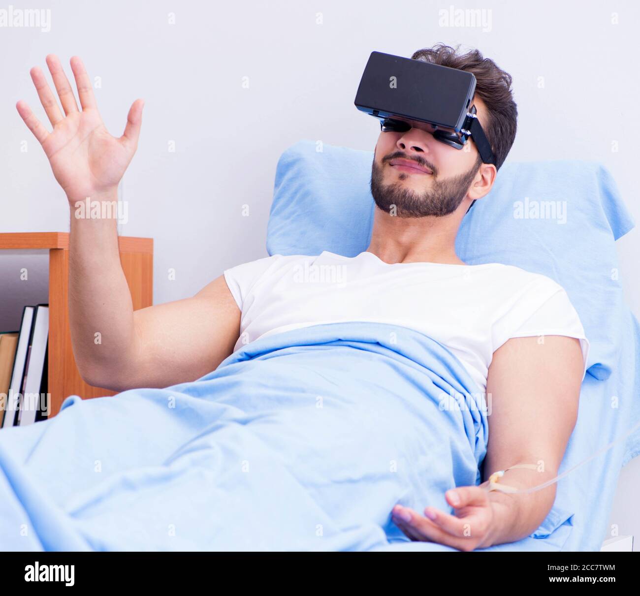 The patient in the hospital with vr glasses headset Stock Photo - Alamy
