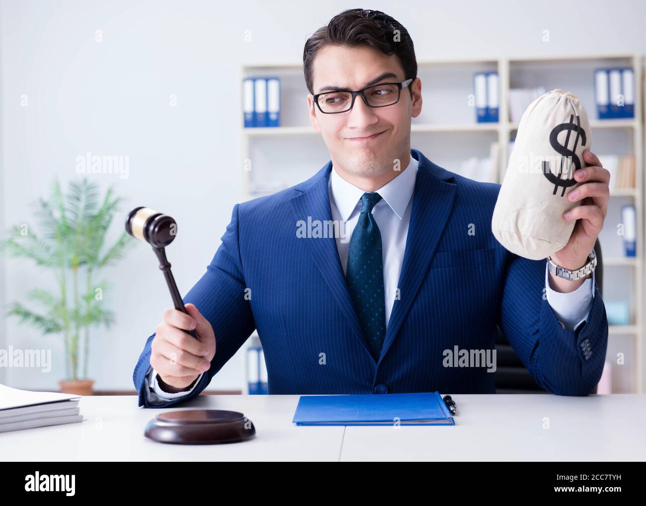 The judge in bribe concept with money Stock Photo - Alamy