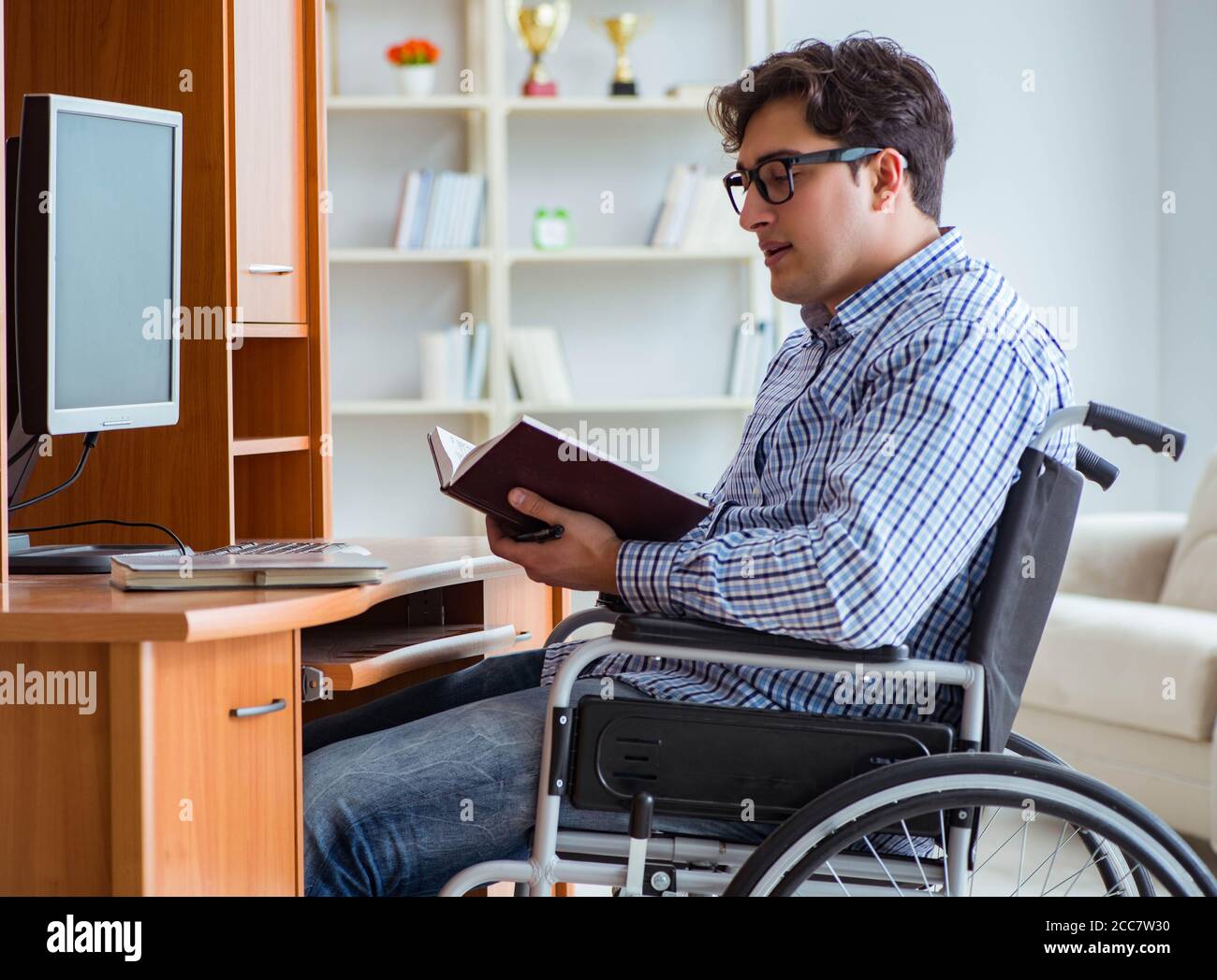 The disabled student studying at home on wheelchair Stock Photo - Alamy