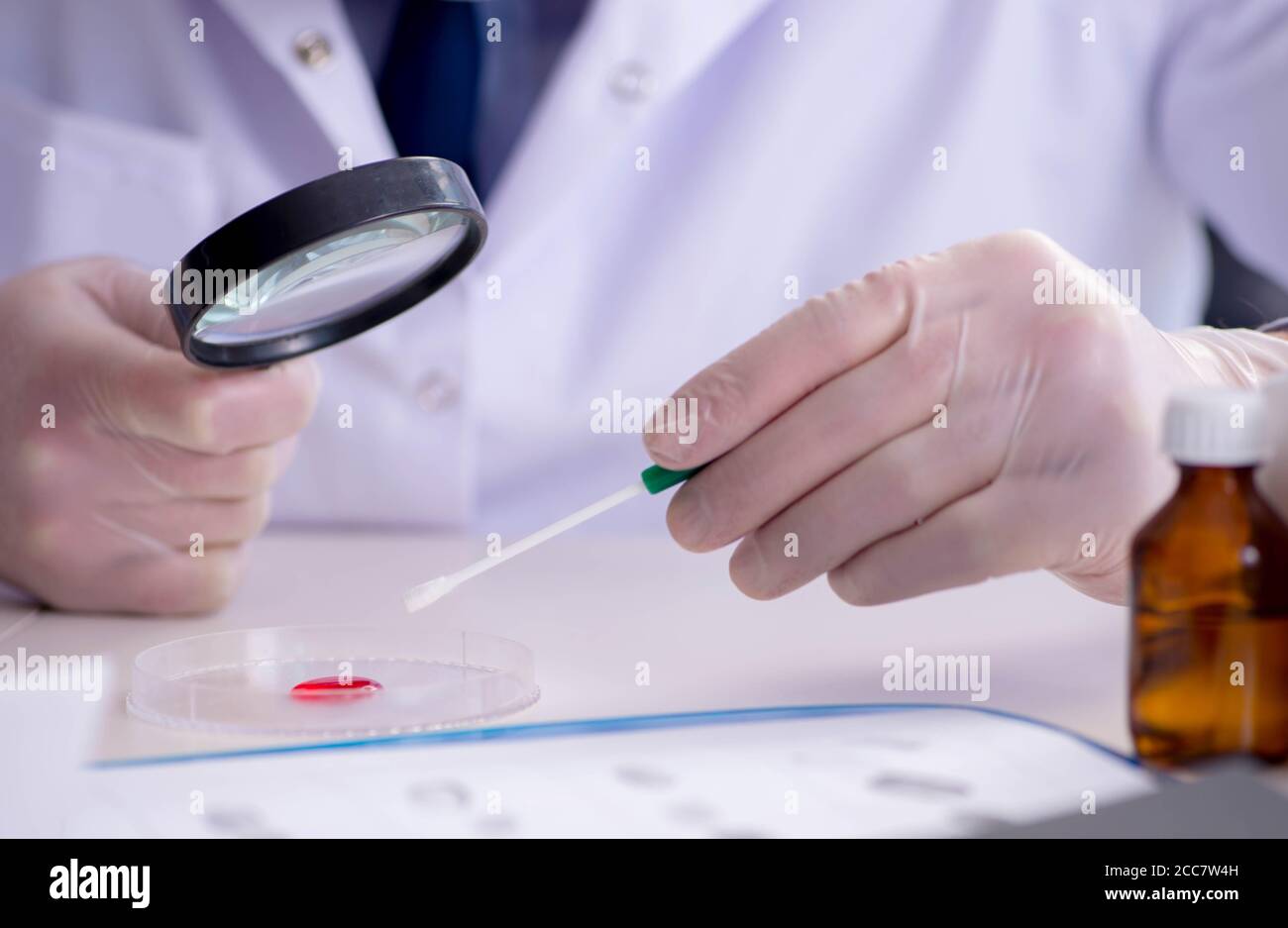 The drug synthesis lab experimentnig with pills Stock Photo - Alamy