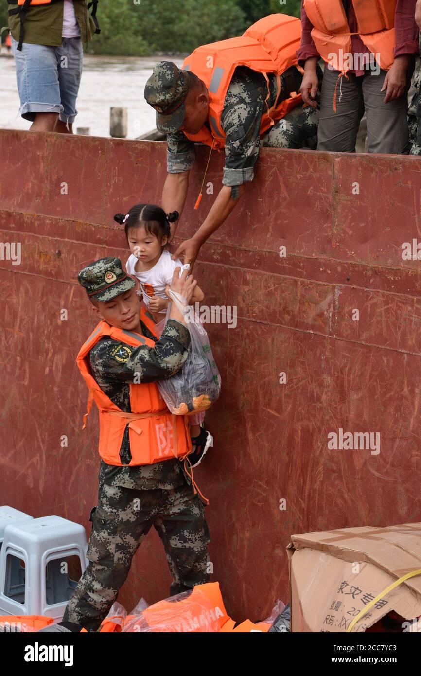Beijing, China's Sichuan Province. 18th Aug, 2020. Rescuers transfer ...