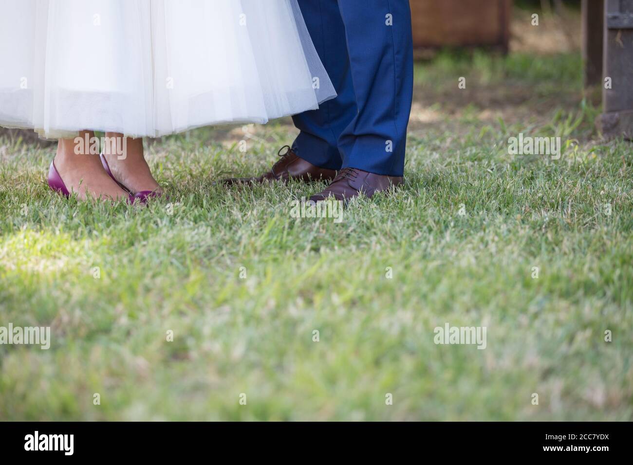 Bride and groom standing together on their wedding day Stock Photo - Alamy
