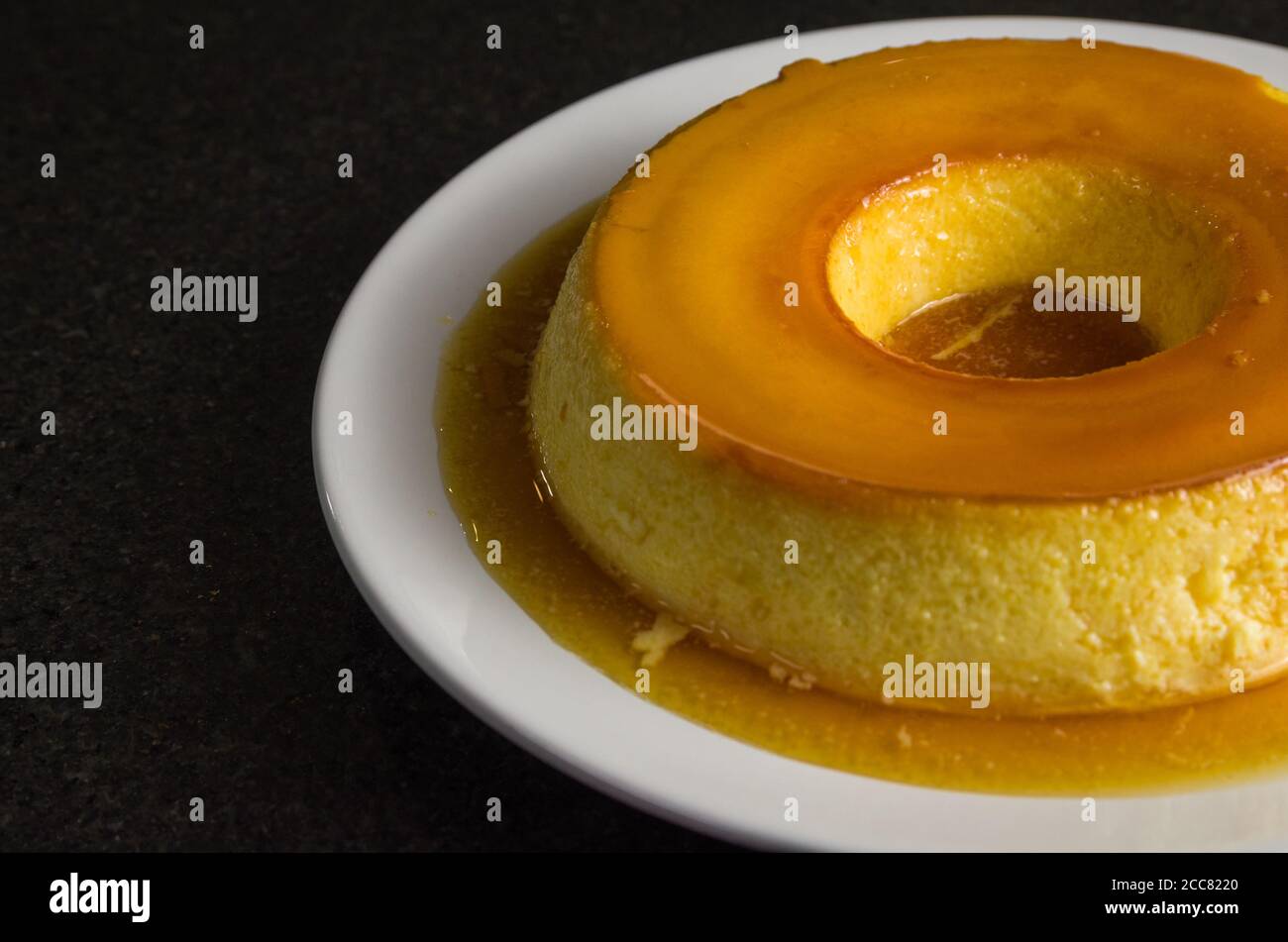 Traditional Brazilian dessert, milk pudding on dark background Stock ...