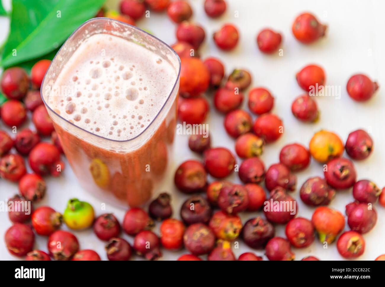 Fruits and red Maca juice. The araçá is a small, rounded fruit with ...