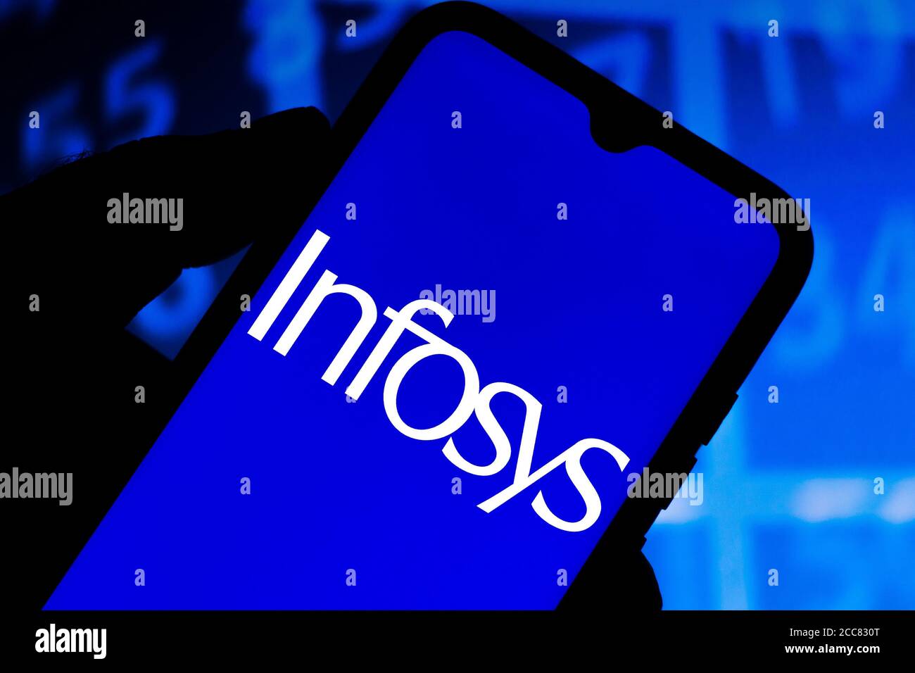 In this photo illustration the Infosys Limited logo seen displayed on a ...