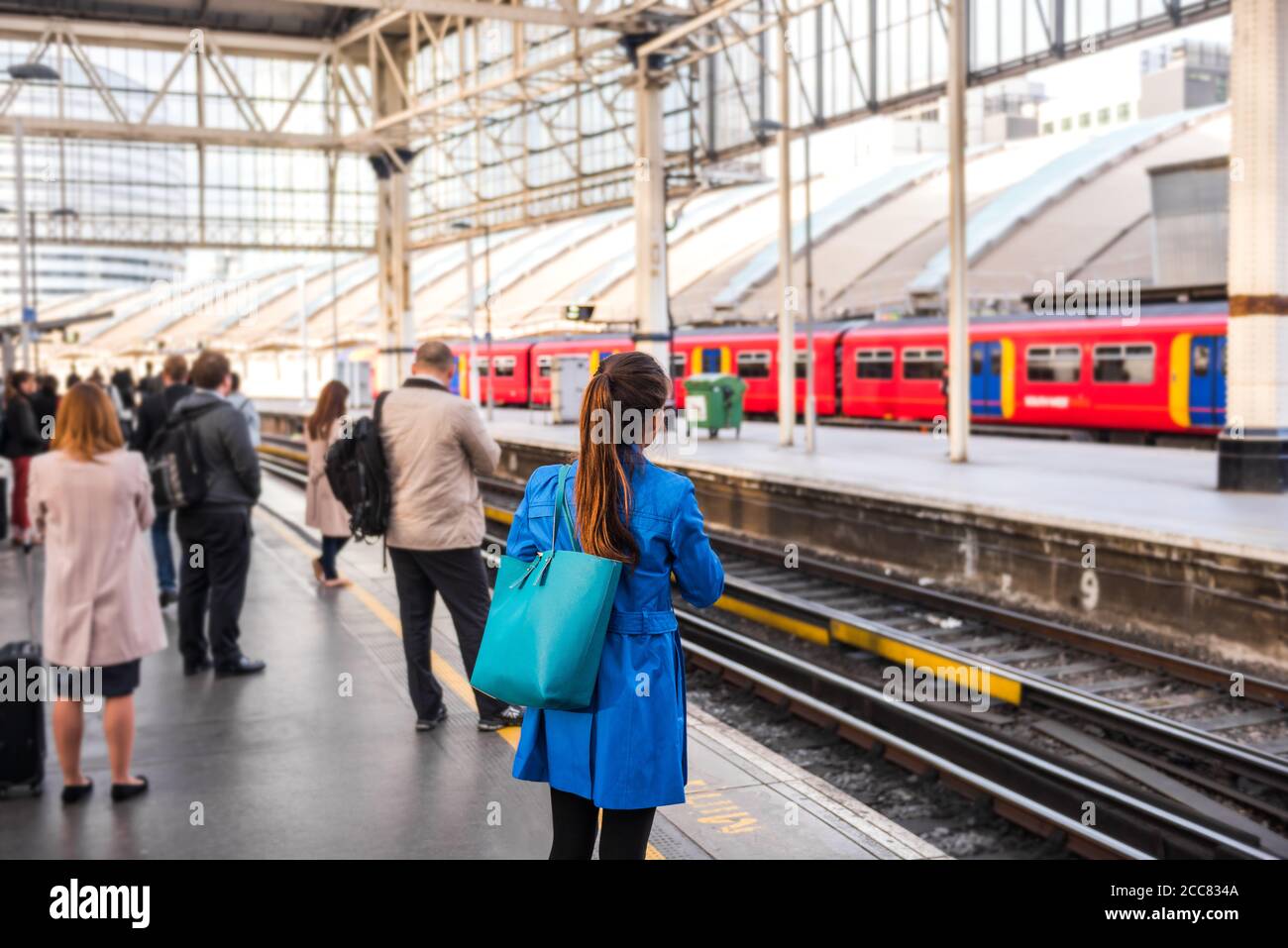 Train station commuters people going to work Stock Photo - Alamy