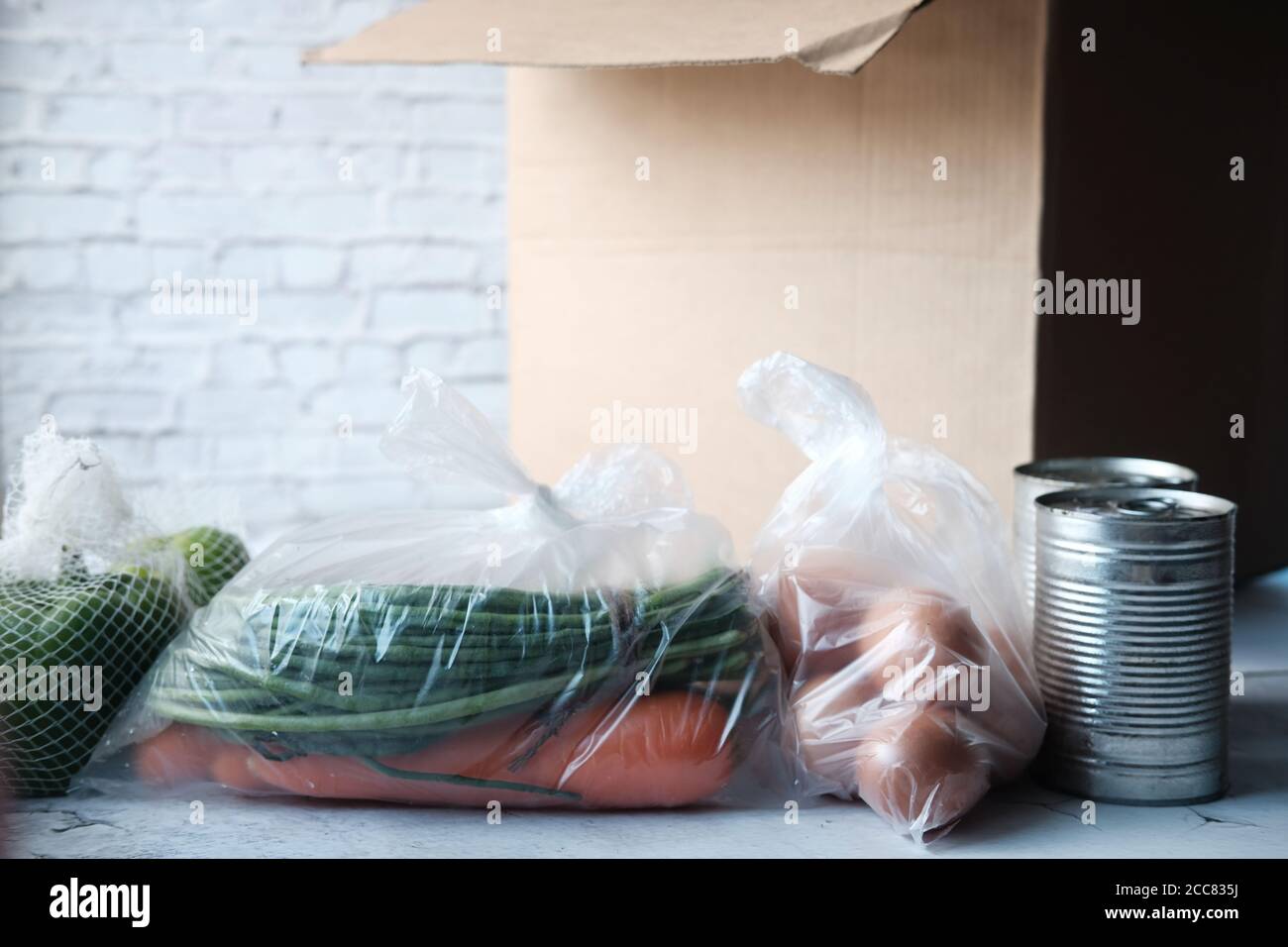 door delivery of goods and a cardboard boxes on table Stock Photo - Alamy