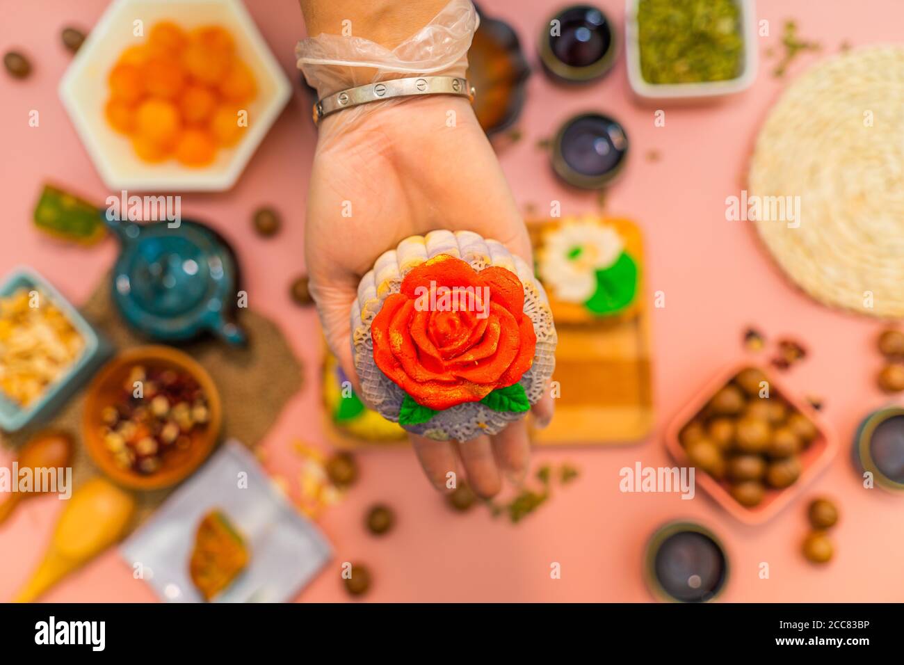 Hands of happy people eating tasty round moon cakes at mid autumn ...
