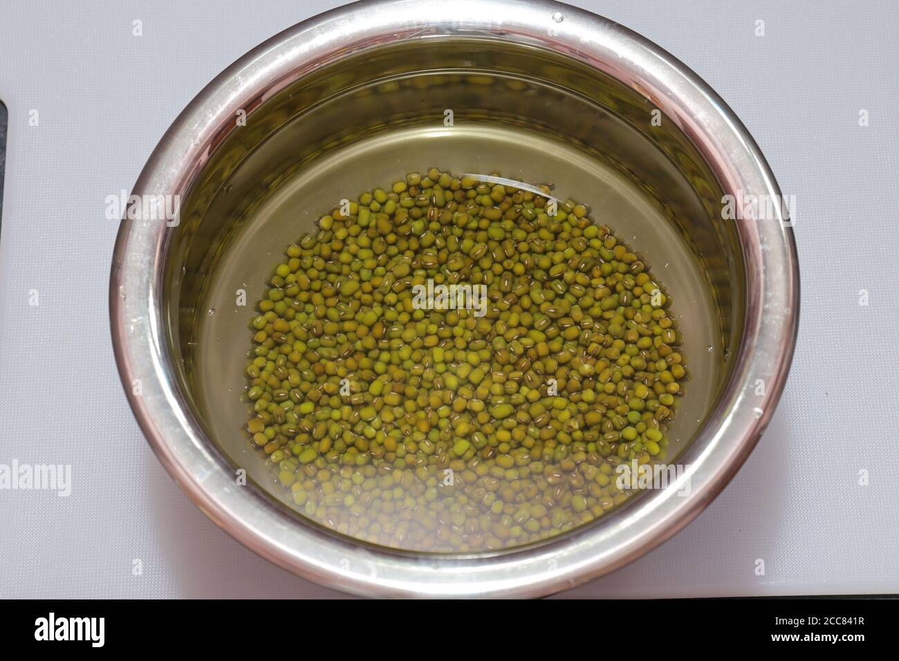 Fresh germinated green gram beans in white background Stock Photo - Alamy