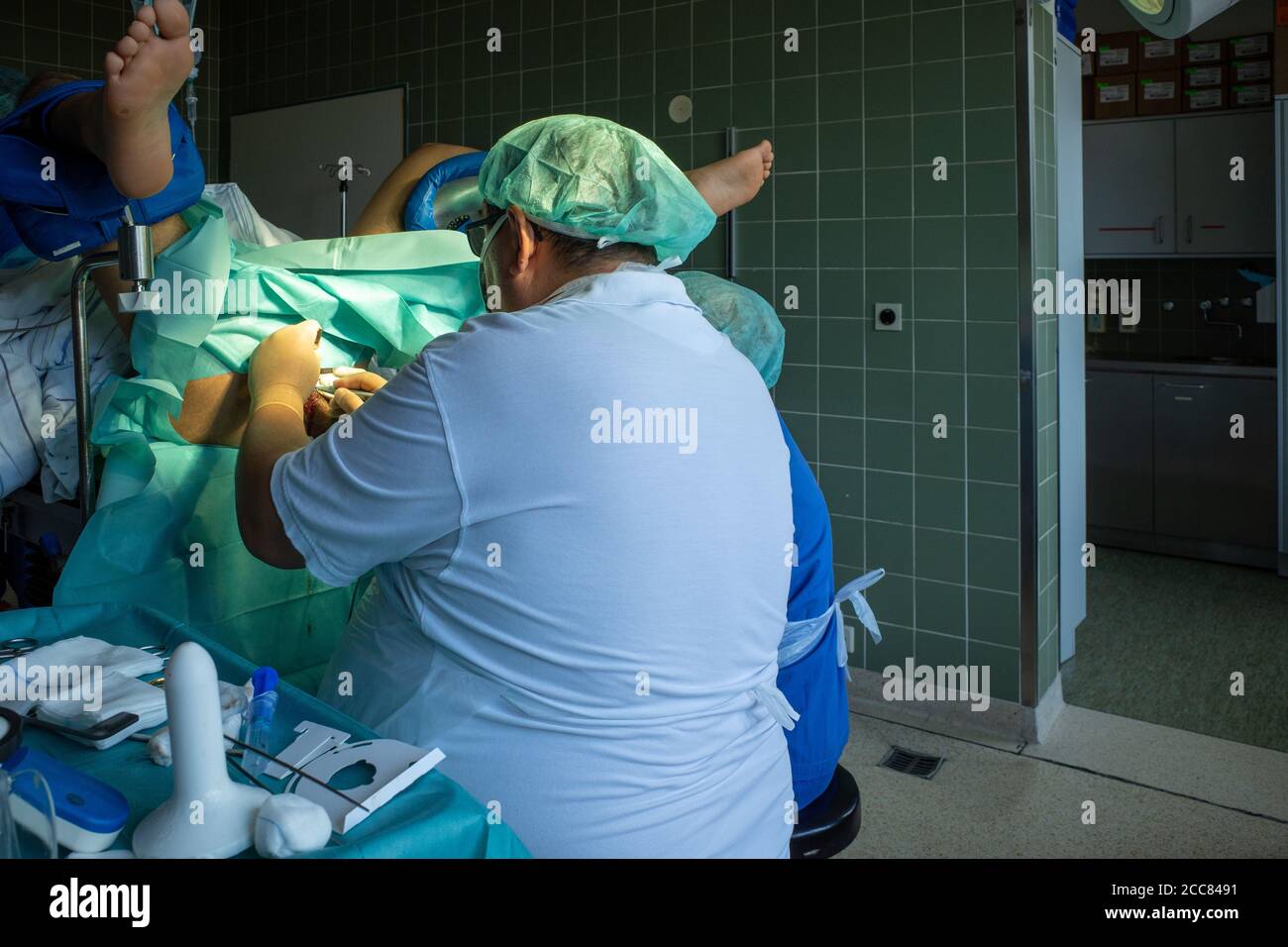 two doctors perform a proctological procedure on one patient Stock ...