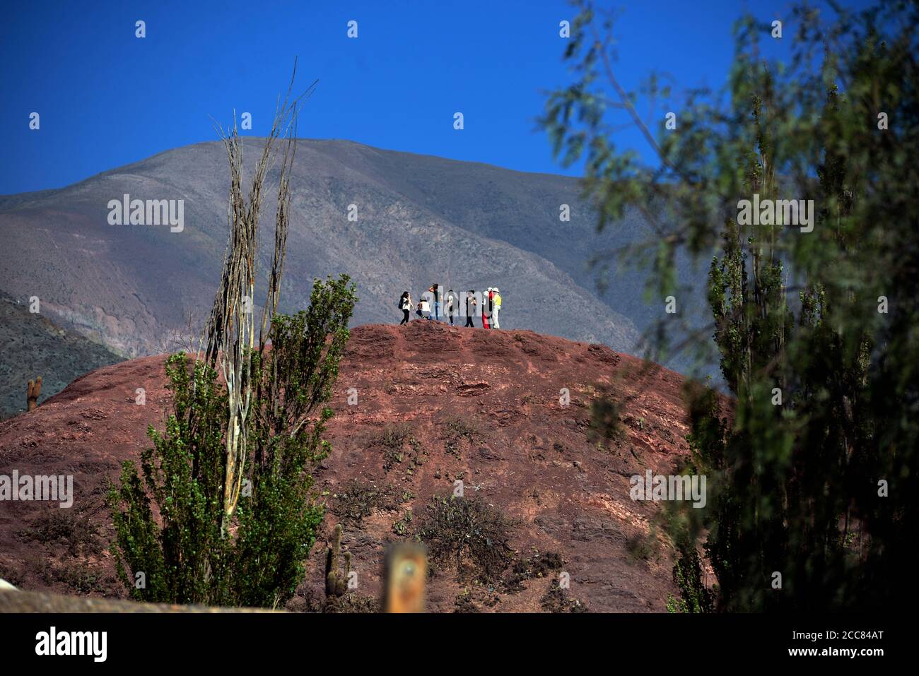Tourists hiking in the Quebrada de Humahuaca UNESCO World Heritage Site ...