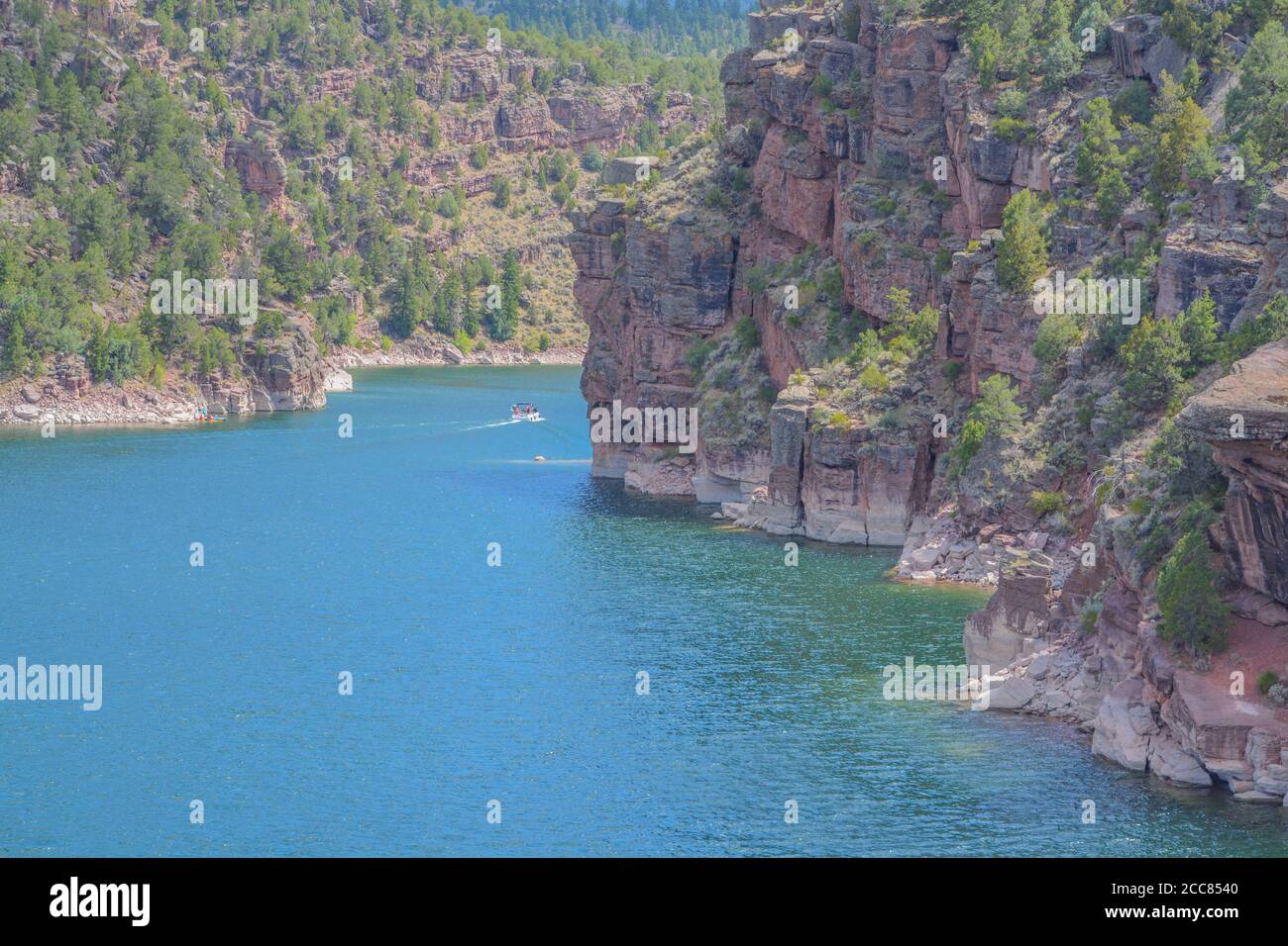 The gorgeous red rook walled Green River flowing through the Flaming ...