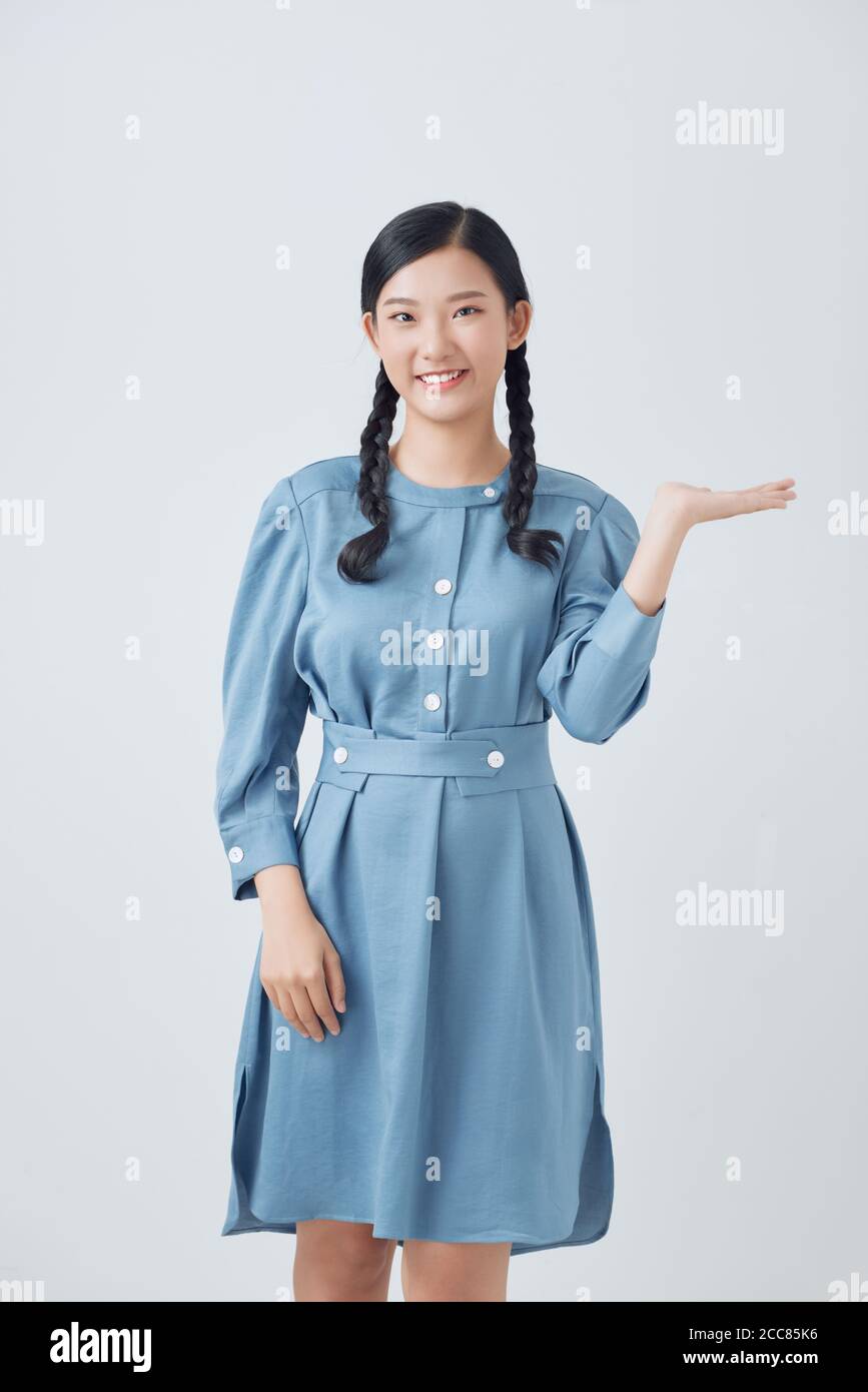 Young asian woman standing over white background smiling cheerful ...