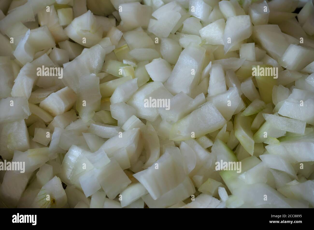 Diced white onion background. Pieces of raw onion close-up. Top view at ...
