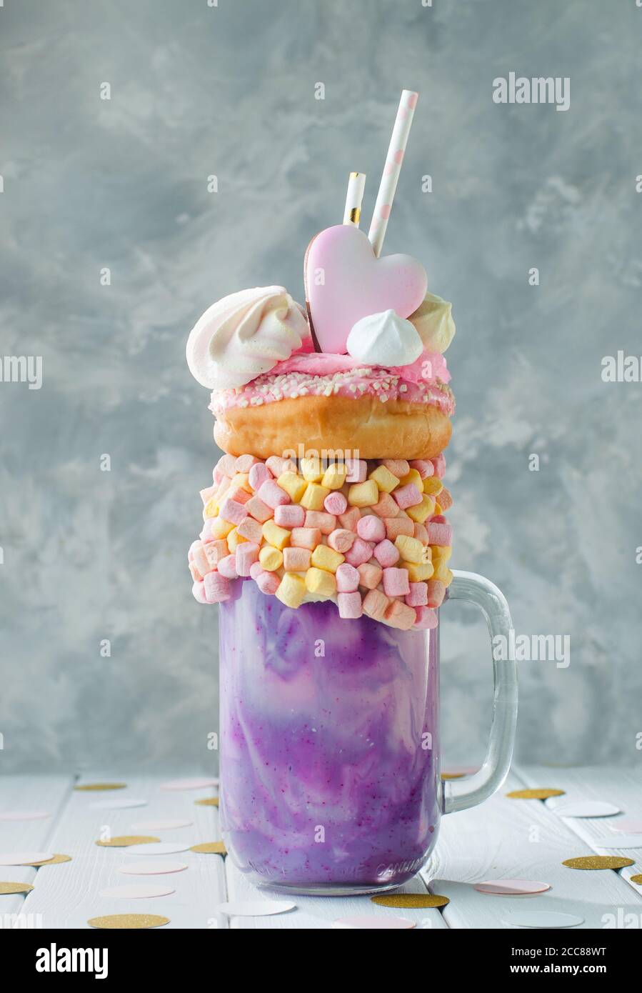Freak shake topping with donut and marshmallow on grey background Stock ...