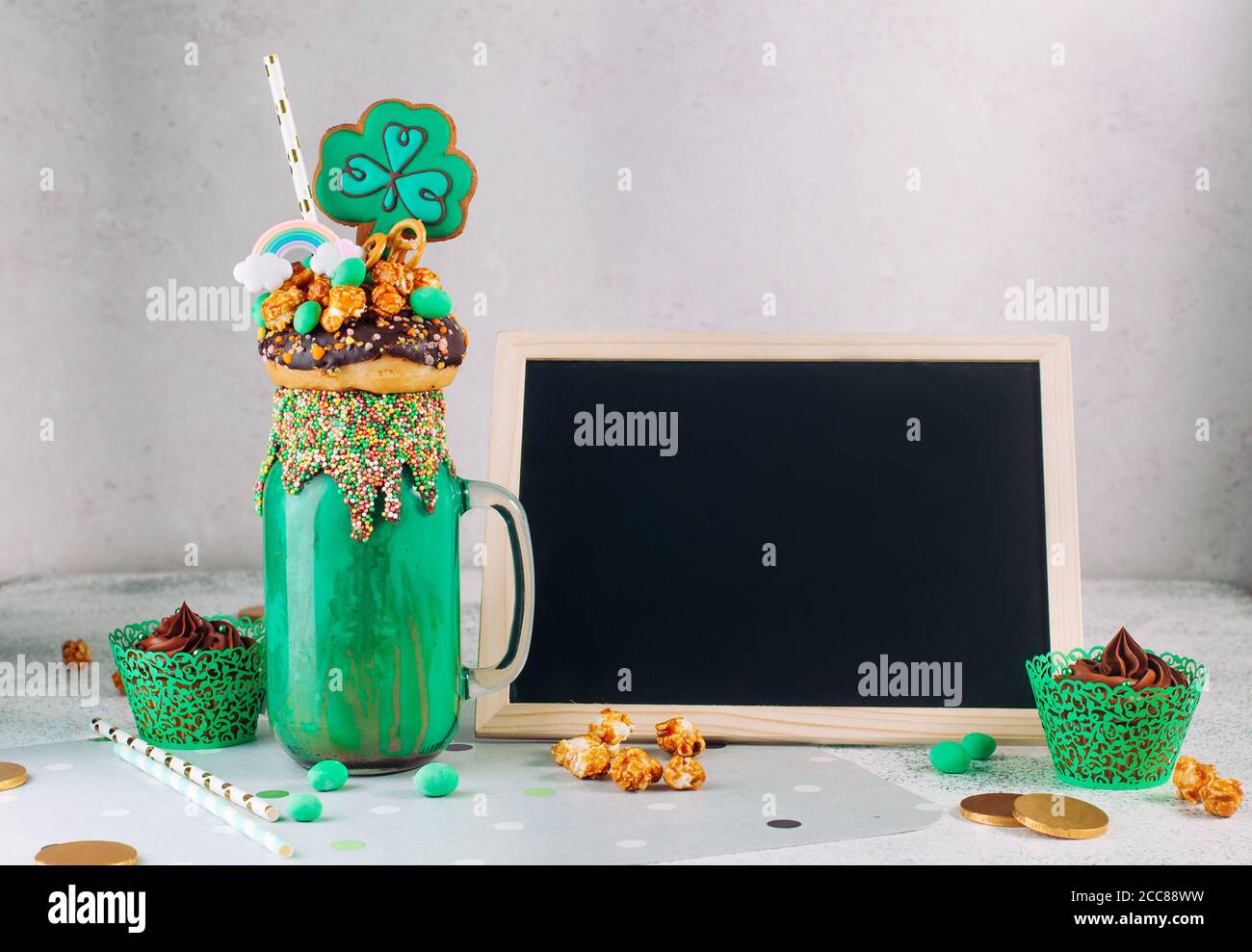 Freak shake topping with clover cookie on grey background with ...