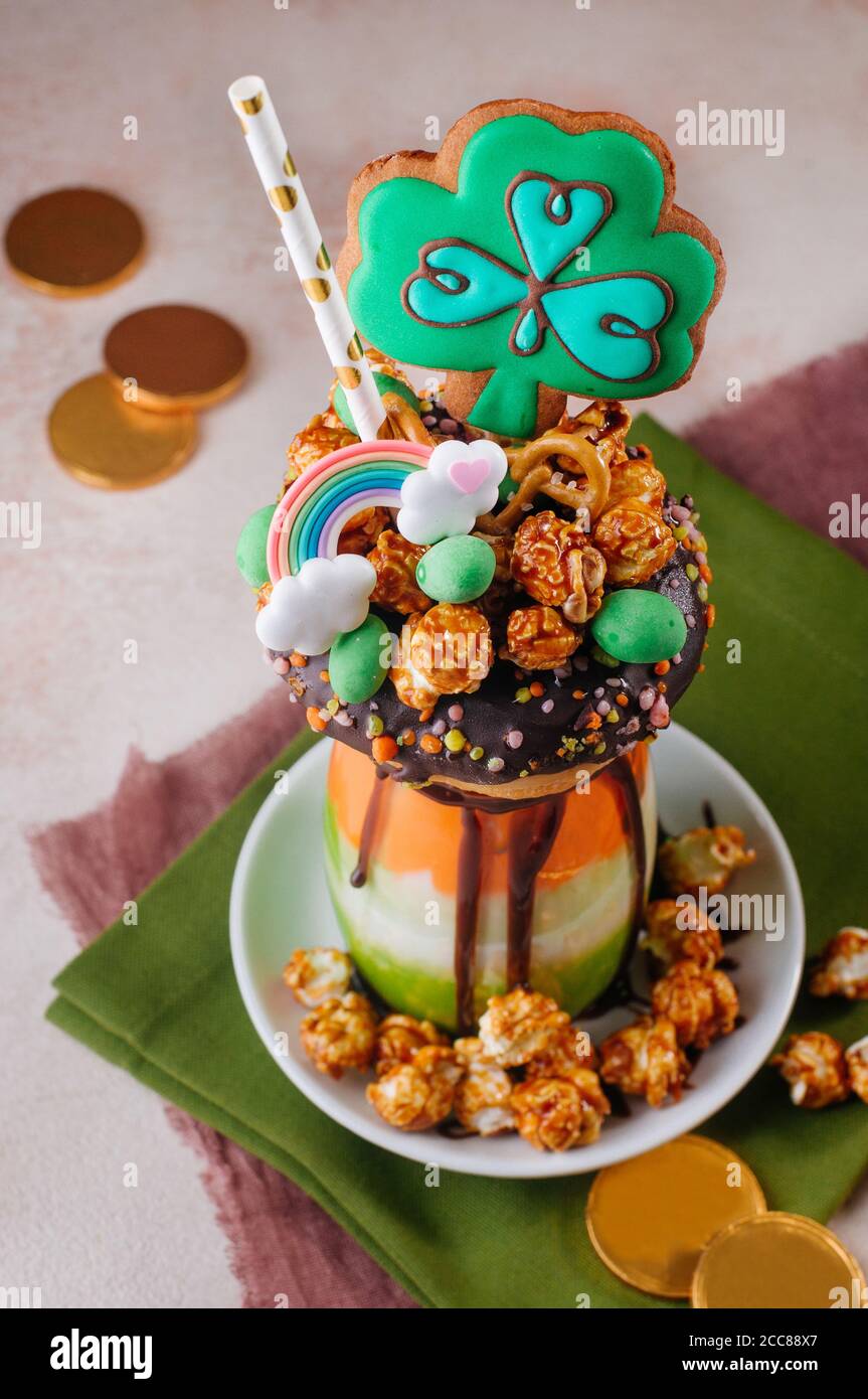 Color freak shake topping with clover cookie on beige background Stock ...