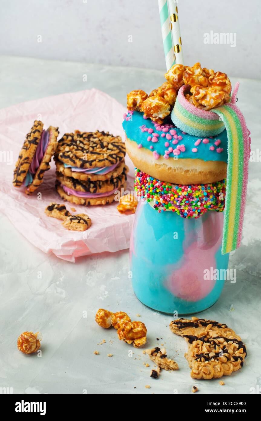 Color freak shake topping with donut over grey background Stock Photo ...