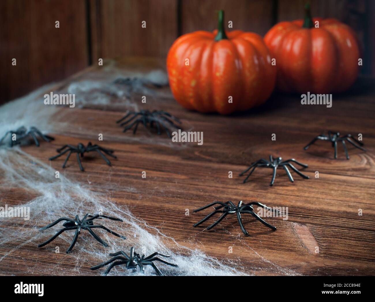 Halloween background with spiders on rustic wooden background Stock ...