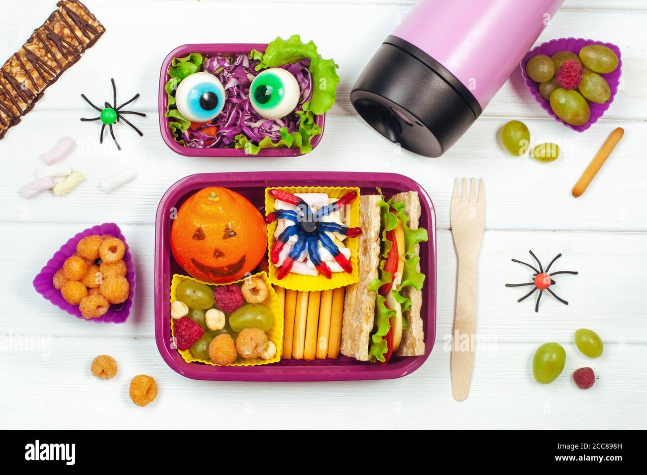 Halloween lunch box with school lunch on white wooden background Stock ...