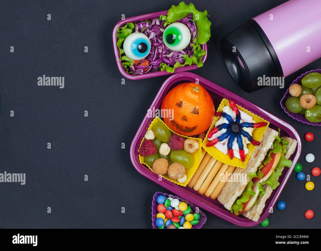 Halloween lunch box with school lunch with sandwich and vegetable salad ...