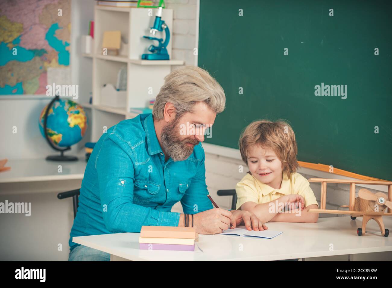 kids learning in classroom. homeschooling concept. close of tracing the ...