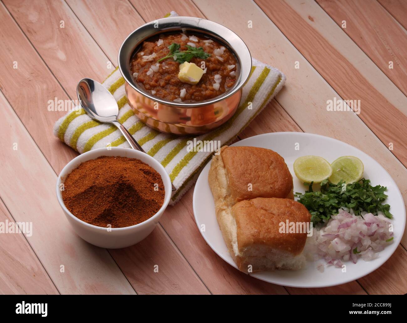 Pav Bhaji Indian spicy fast food with bread, onion and butter, Indian ...