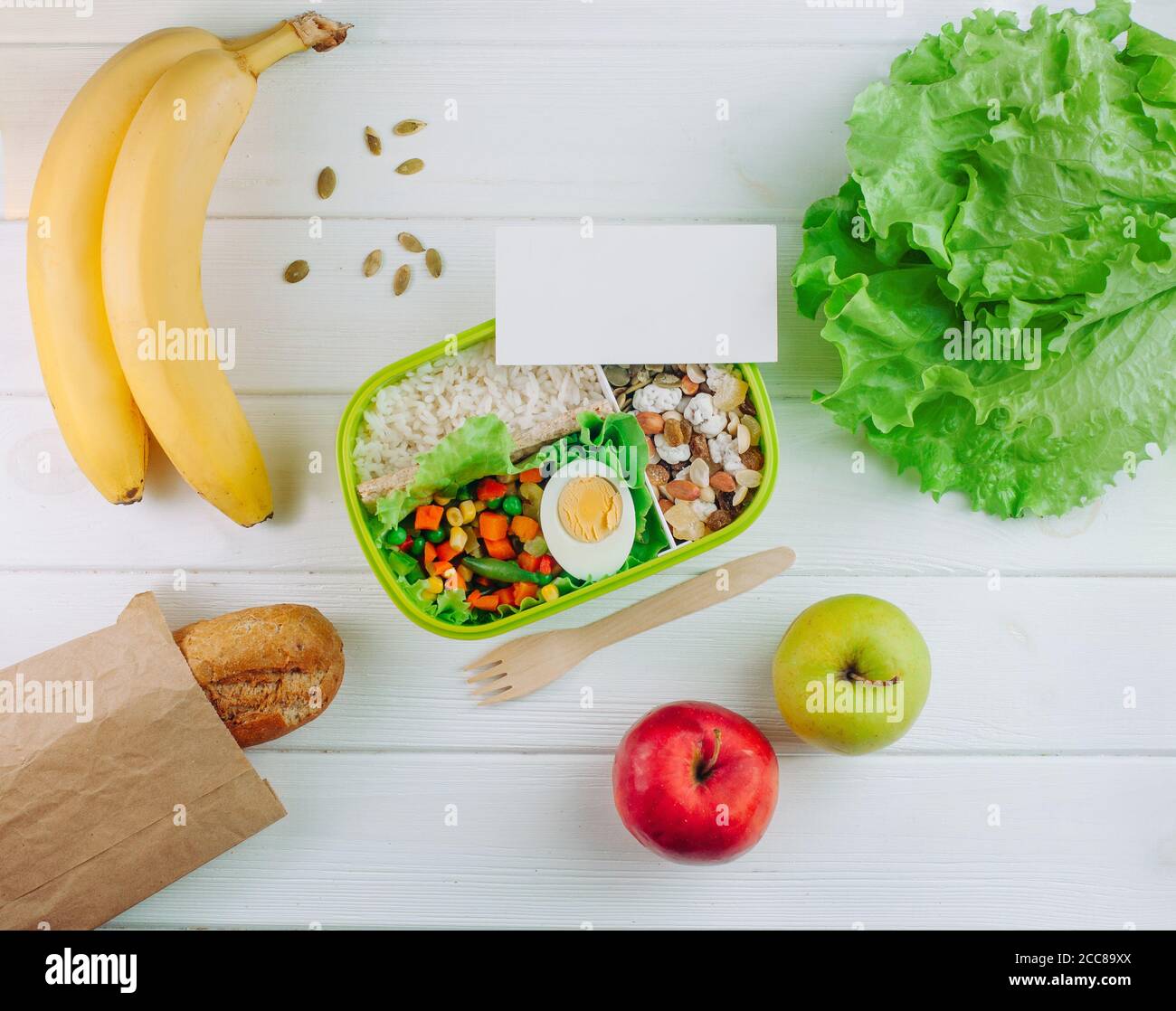 Lunch box with empty blank with copy space on white wooden background ...