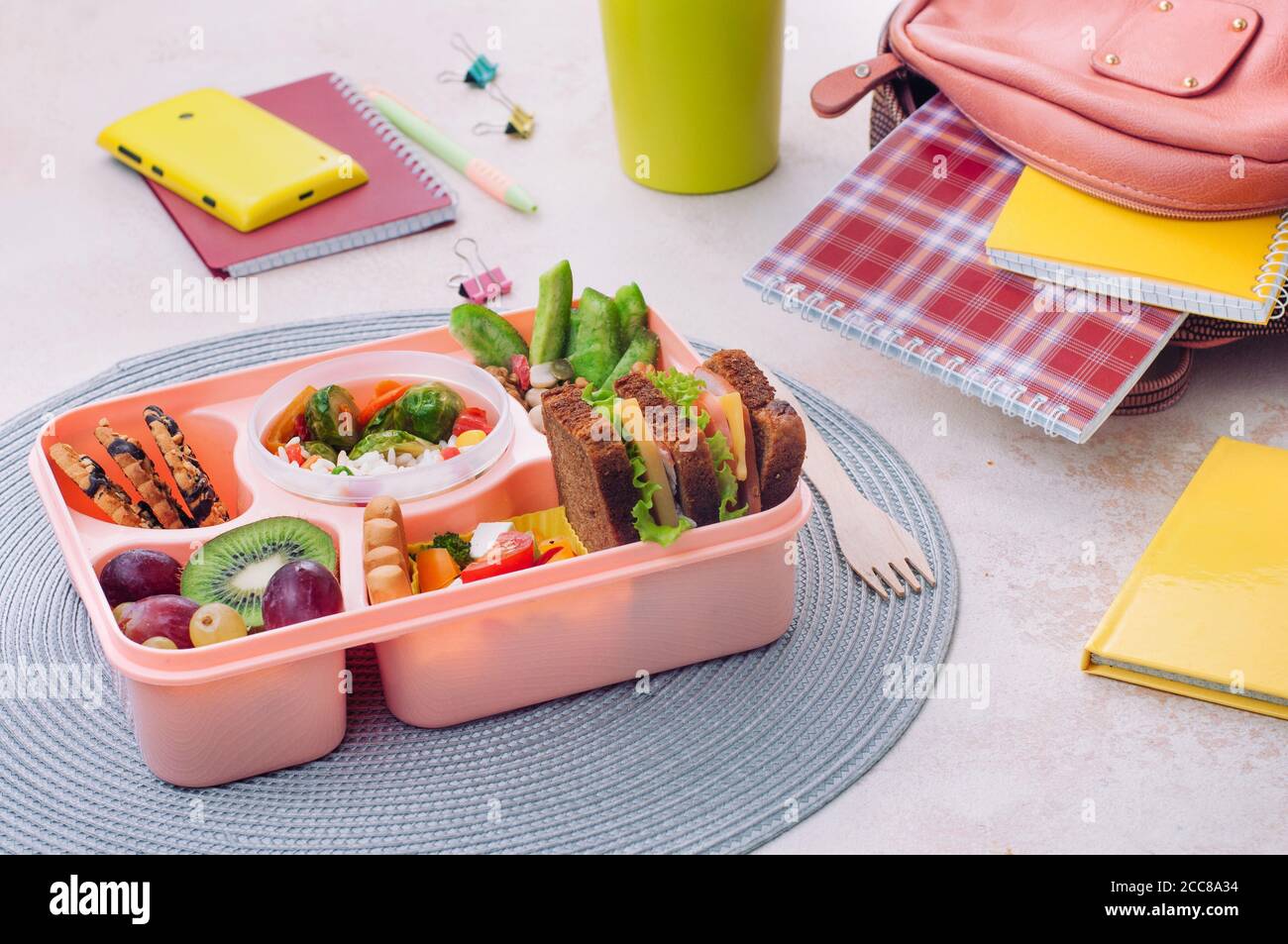 Lunch box with sandwiches, vegetable salad, fresh fruits and nuts on ...