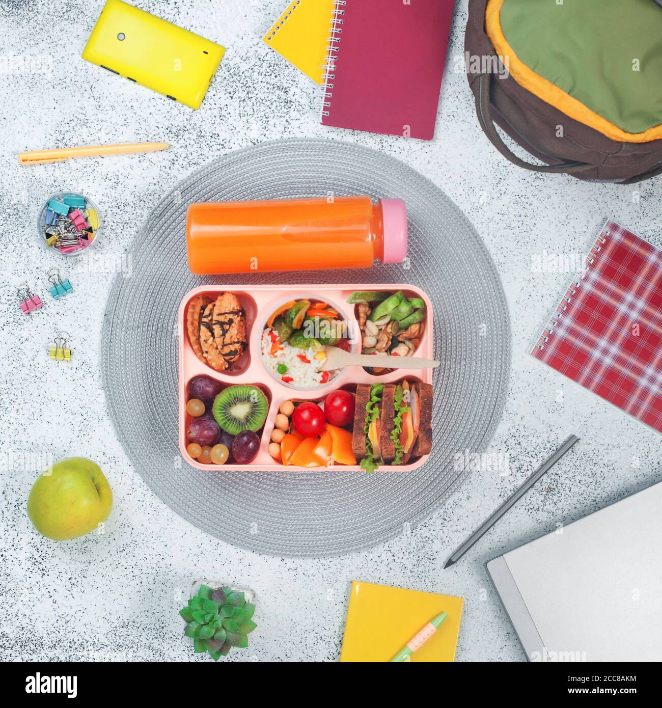Open lunch box with healthy food on the grey background with school ...