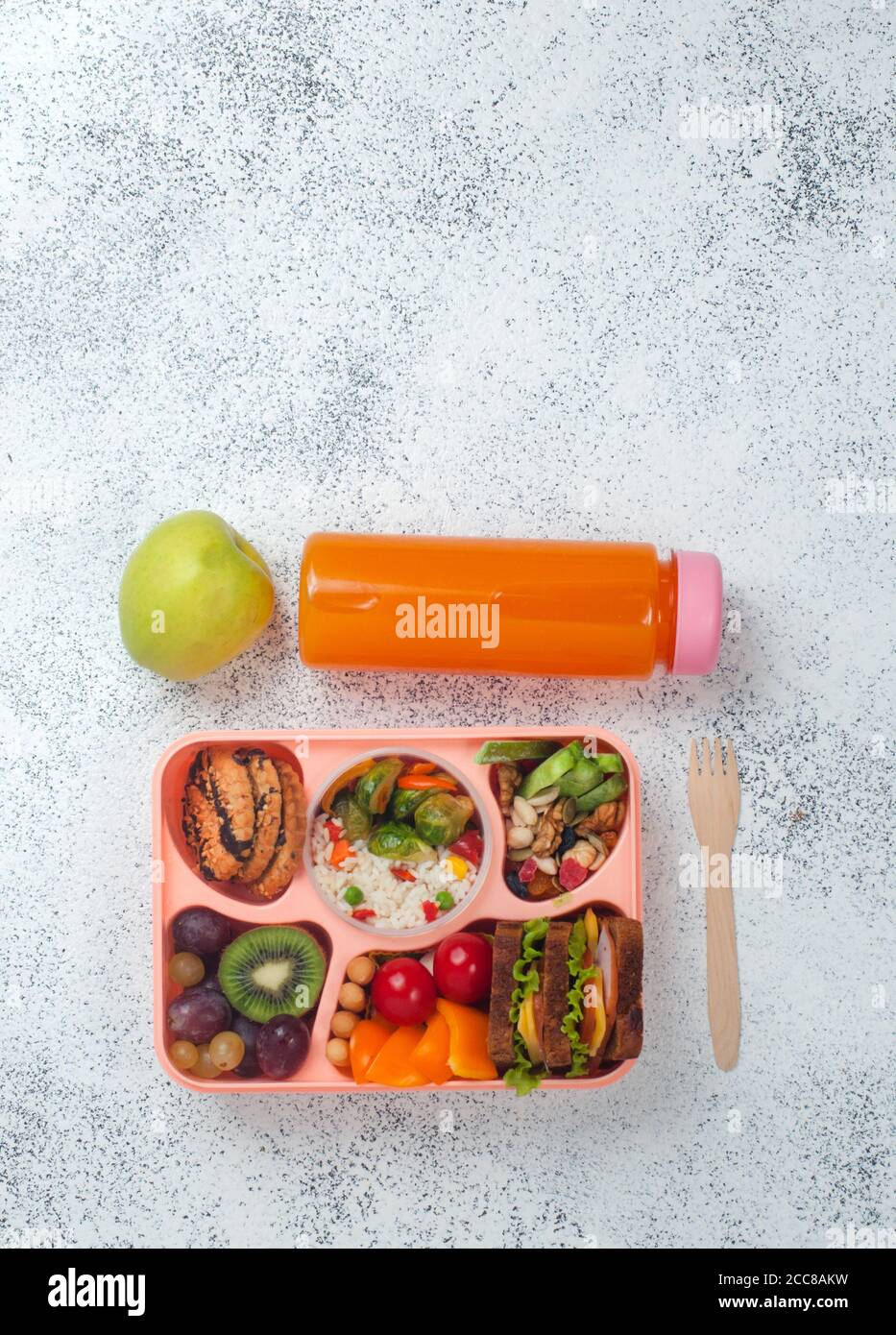 Open lunch box with healthy lunch on the grey background with copy ...