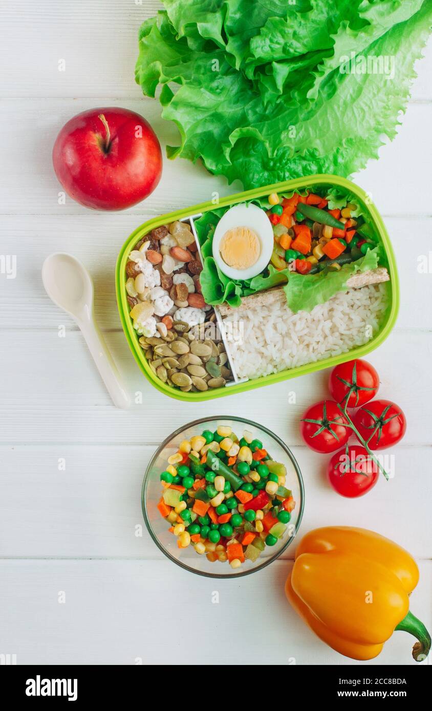 Top view of lunch box on light wooden background Stock Photo - Alamy