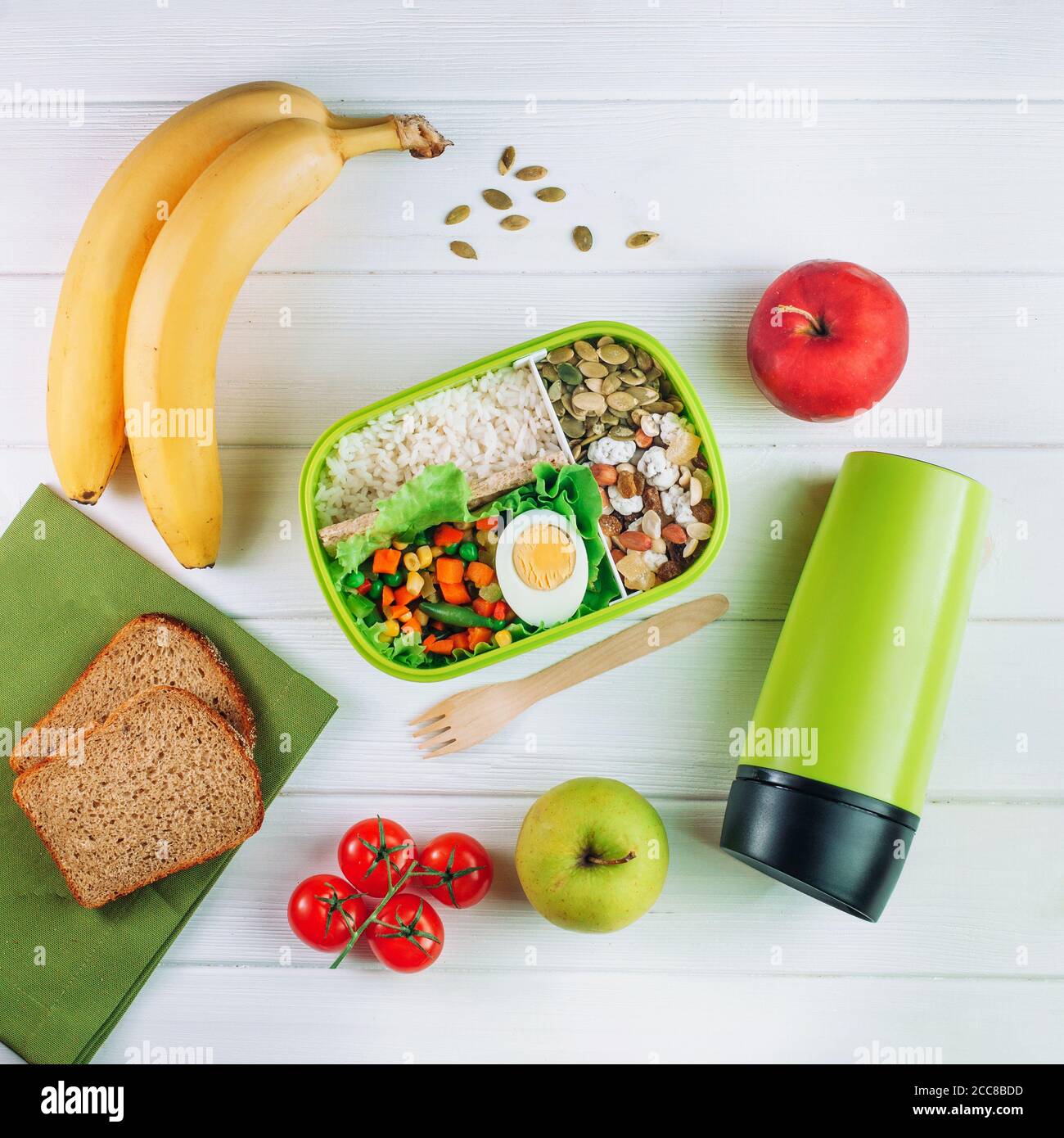 Top view of lunch box on light wooden background Stock Photo - Alamy