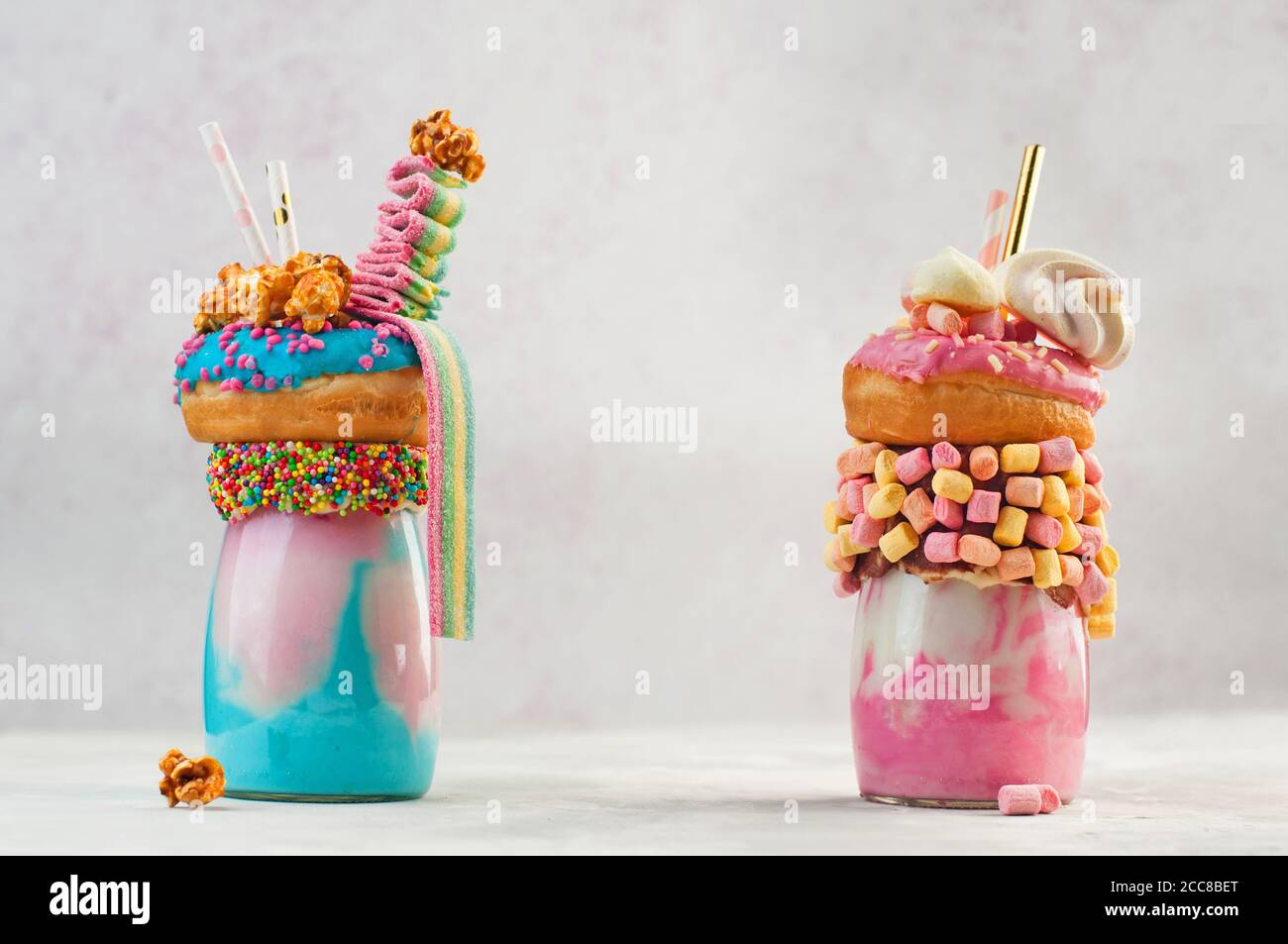 Two freak shakes on grey background with copy space Stock Photo - Alamy