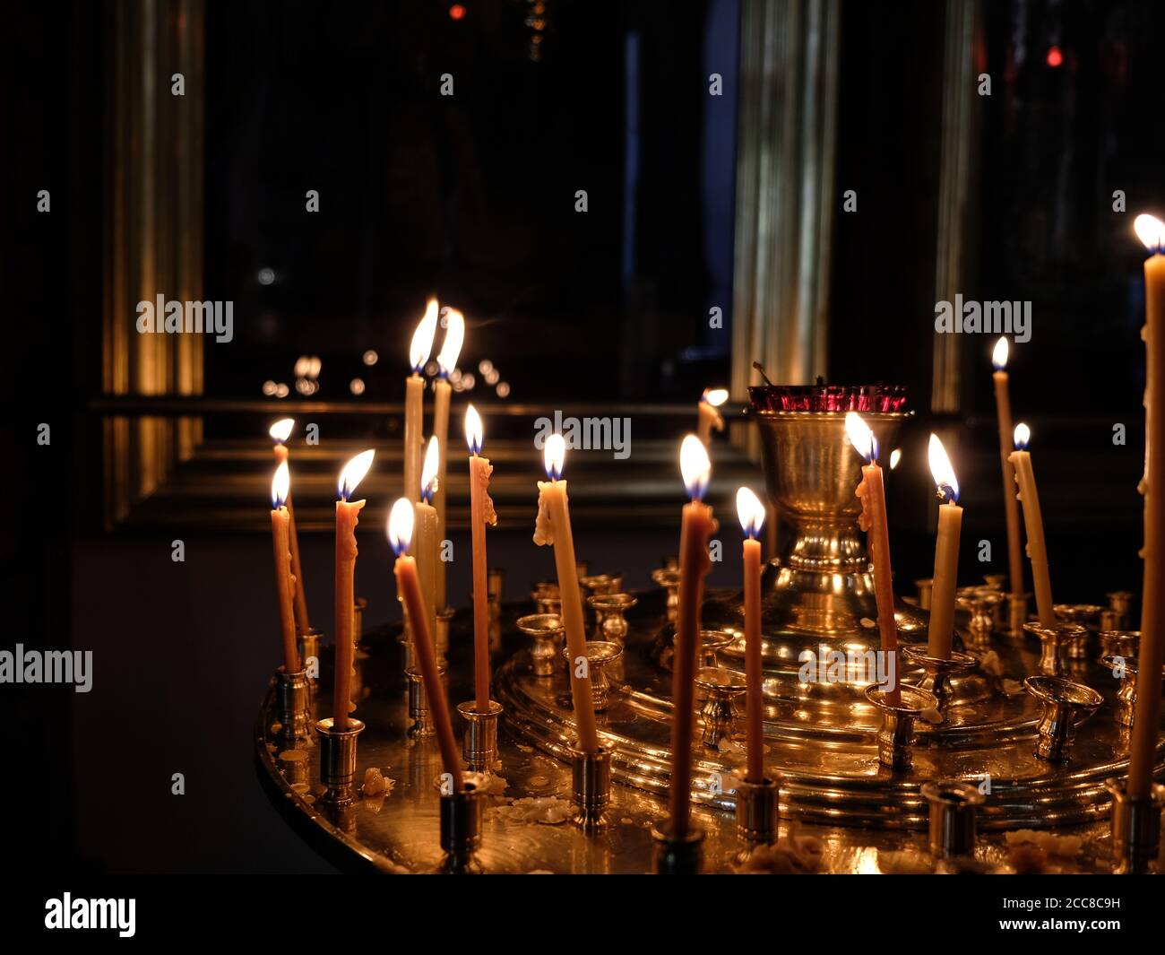 Burninig candles in the church, christian tradition Stock Photo - Alamy