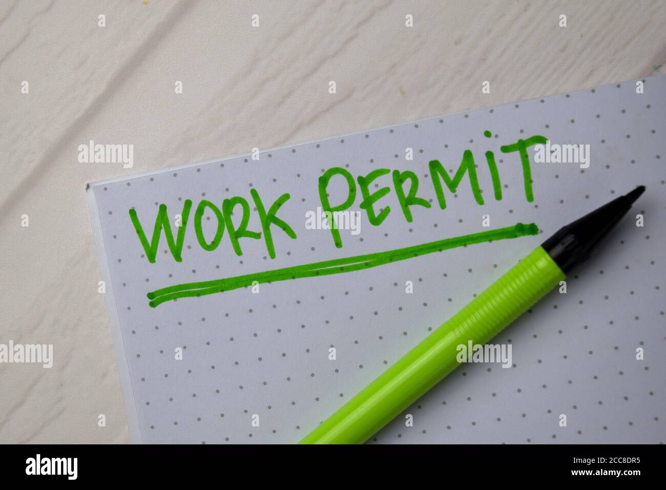 Work Permit write on a book isolated on office desk Stock Photo - Alamy