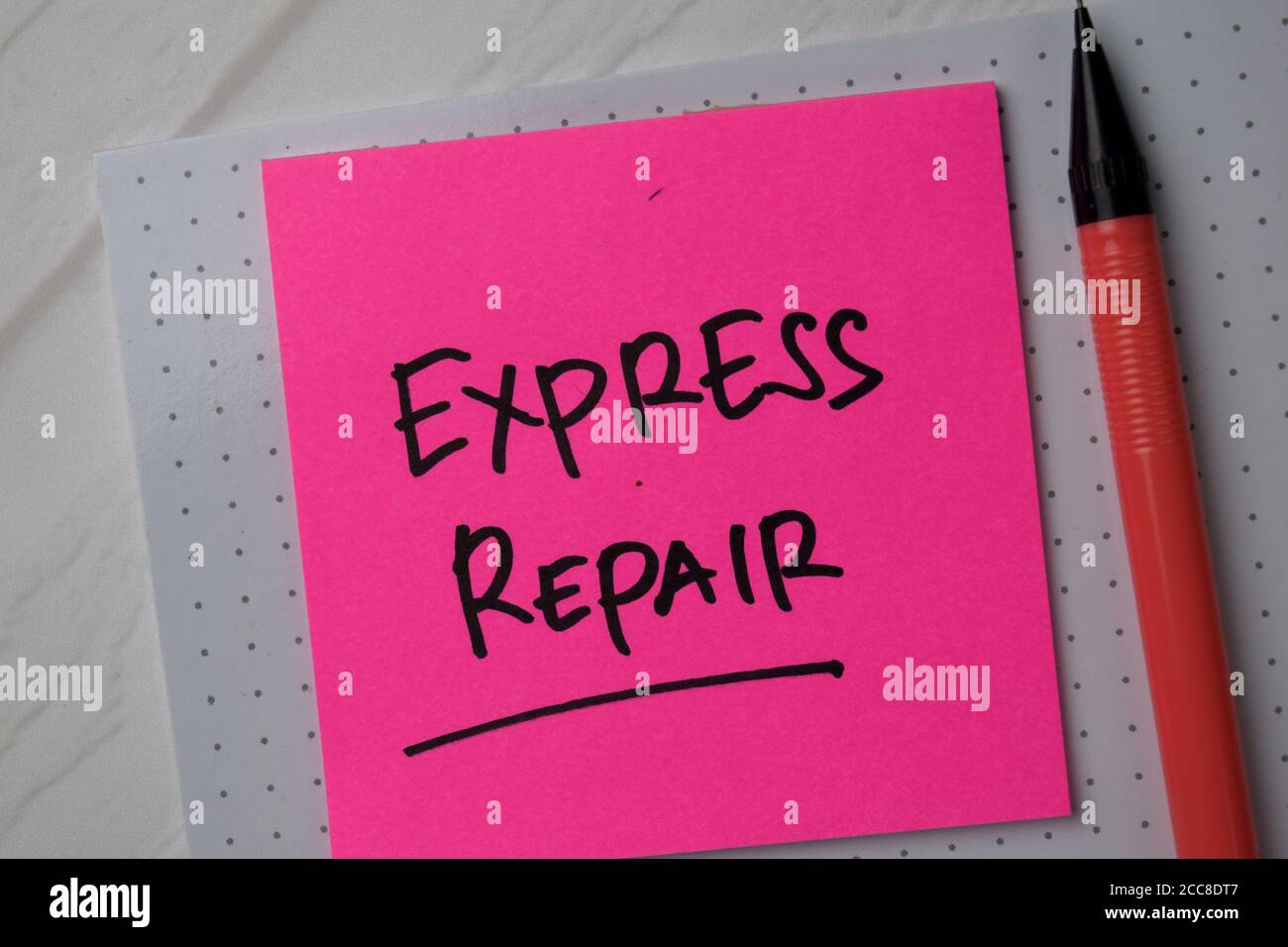 Express Repair text on sticky notes with office desk Stock Photo - Alamy