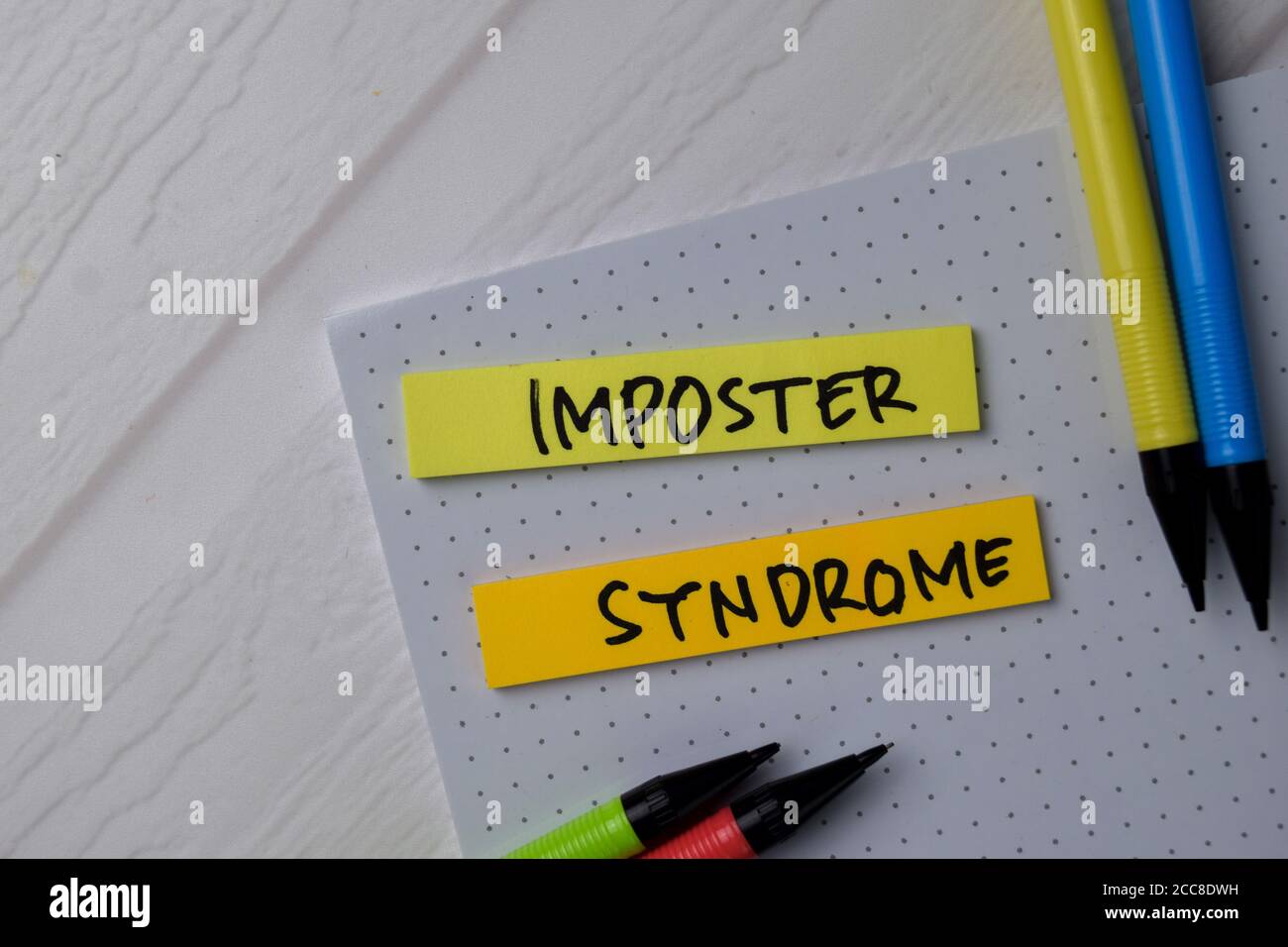 Imposter Syndrome text on sticky notes isolated on office desk Stock ...