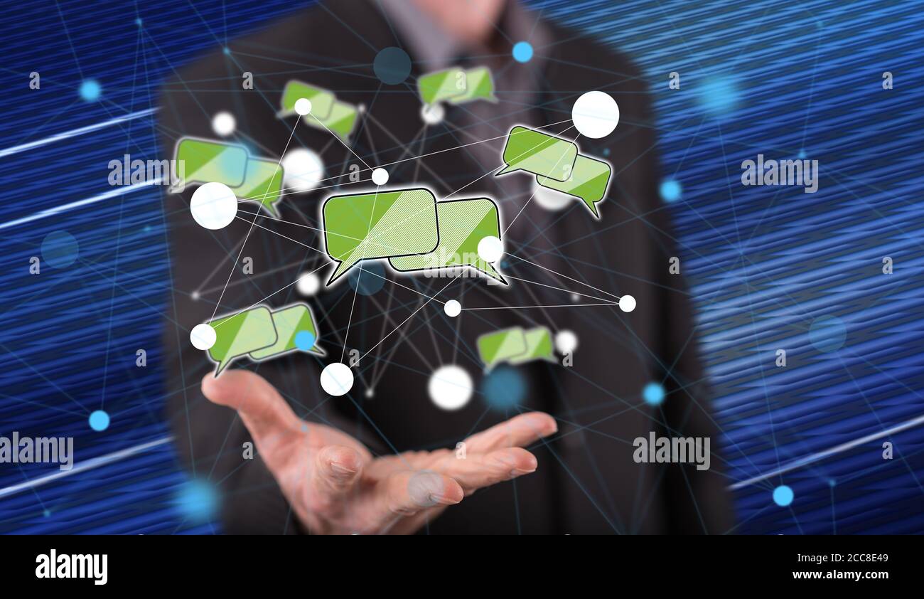 Communication network concept above the hand of a man in background ...