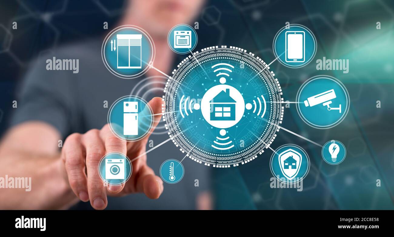 Man touching a smart home concept on a touch screen with his finger ...