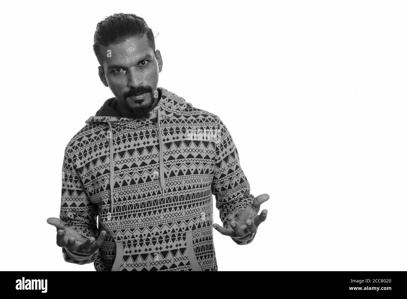 Young Indian man with both arms raised Stock Photo - Alamy